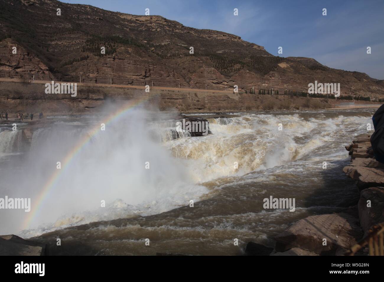 Landscape of a rainbow over the Hukou Waterfall of the Yellow River in ...