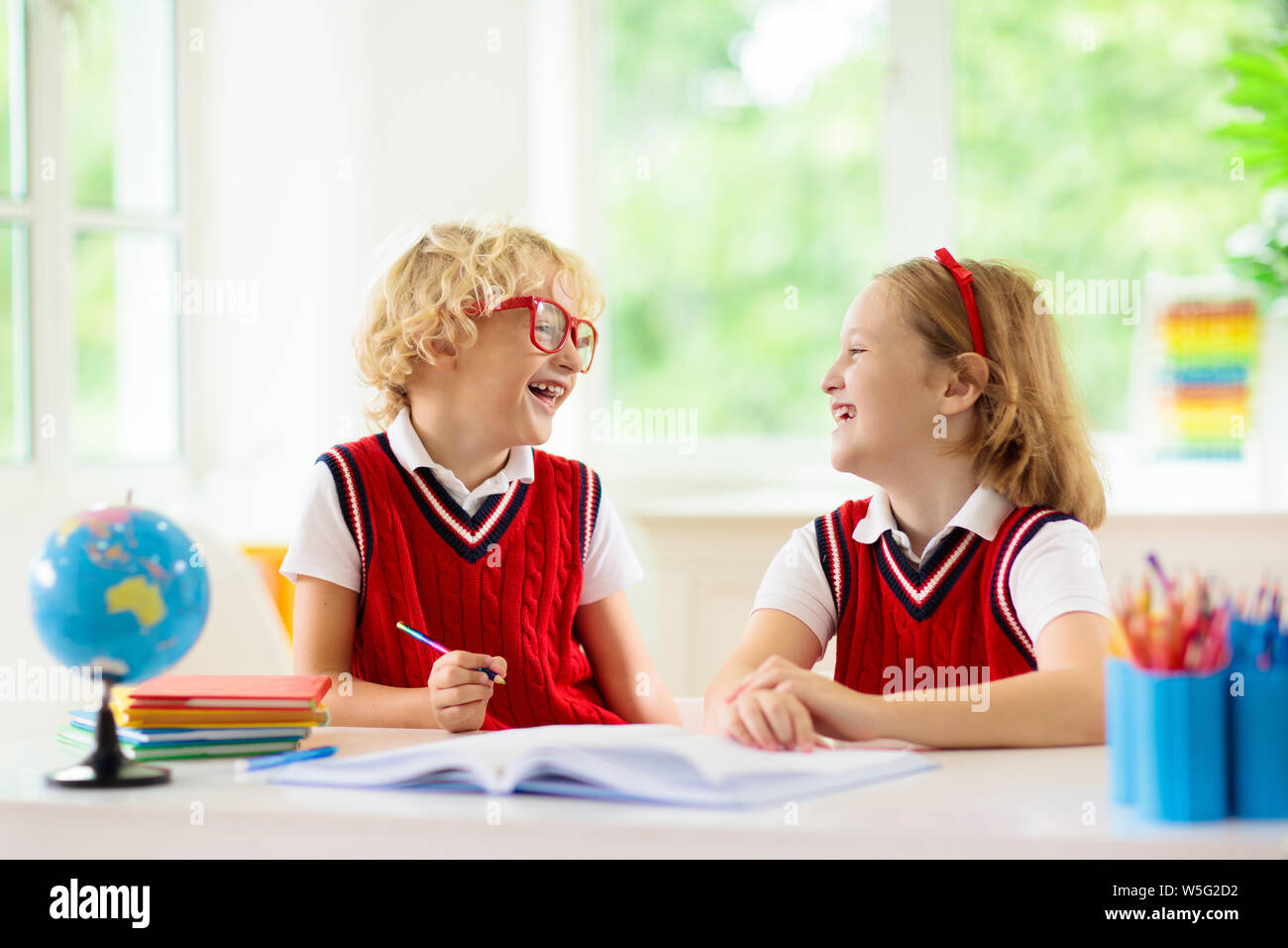 Kids go back to school. Children study and learn for preschool. Boy and ...