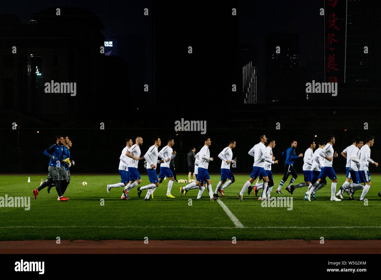 Players of Uzbekistan national men's football team take part in a ...