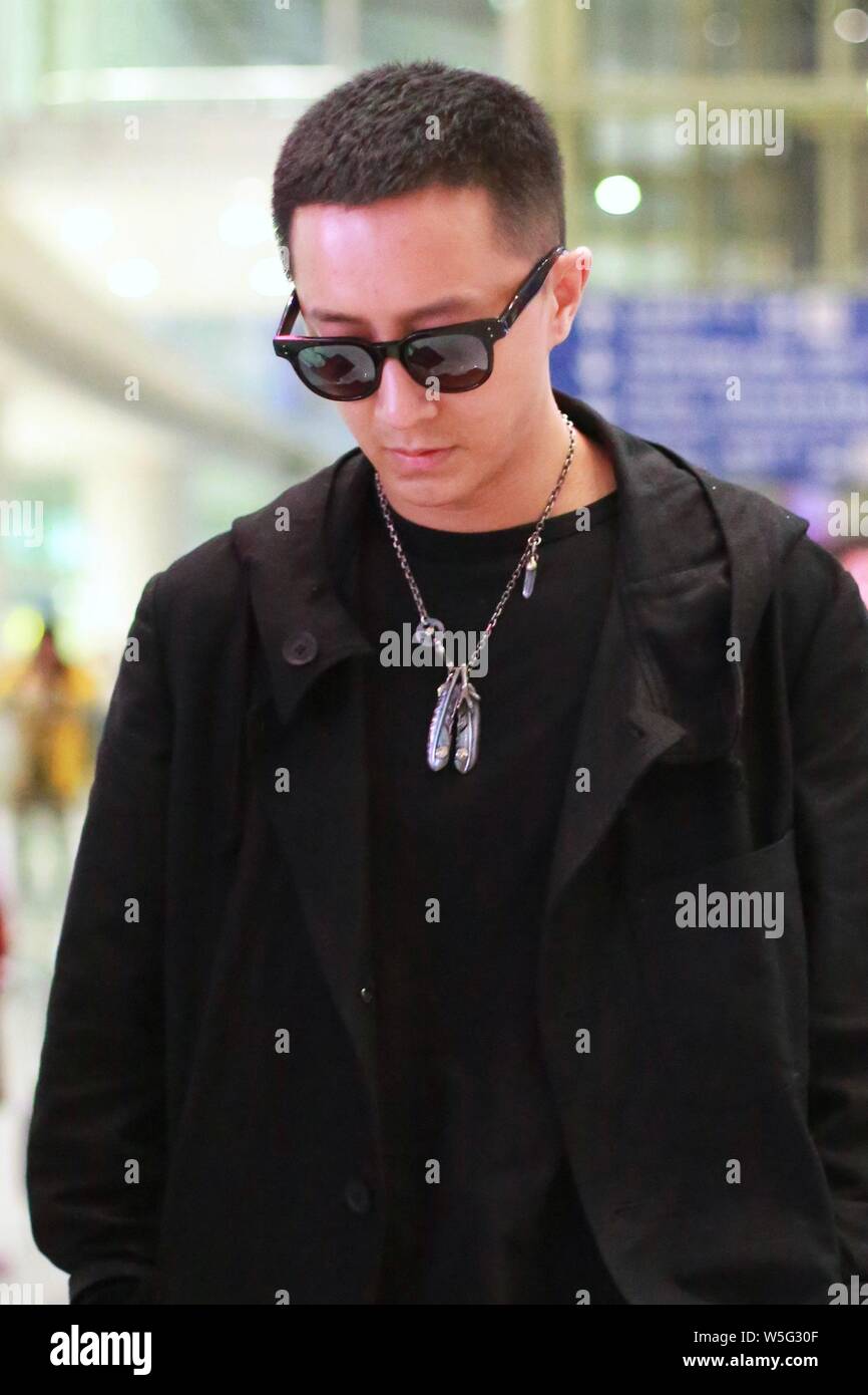 Chinese singer and actor Han Geng arrives at the Beijing Capital ...