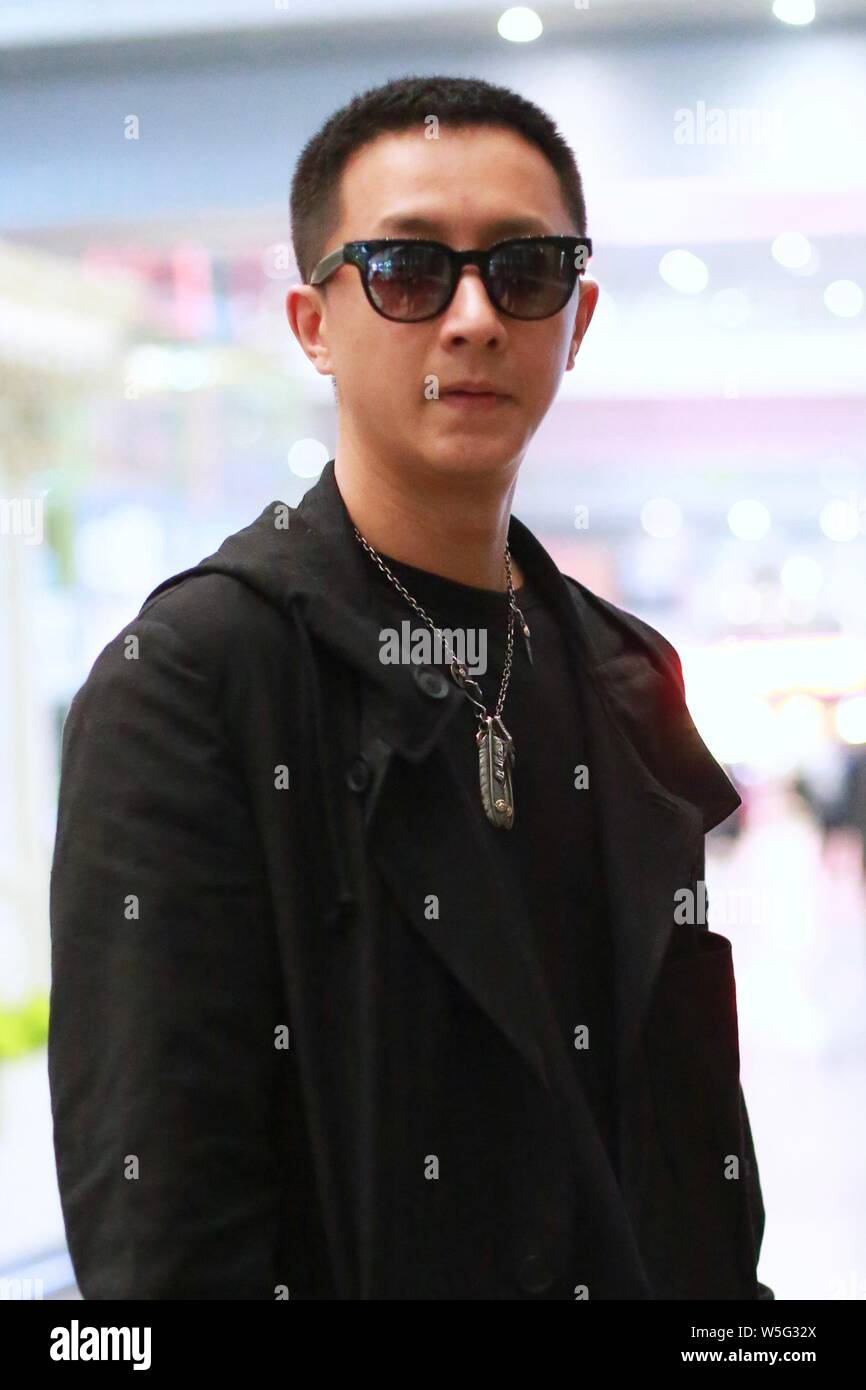 Chinese singer and actor Han Geng arrives at the Beijing Capital ...