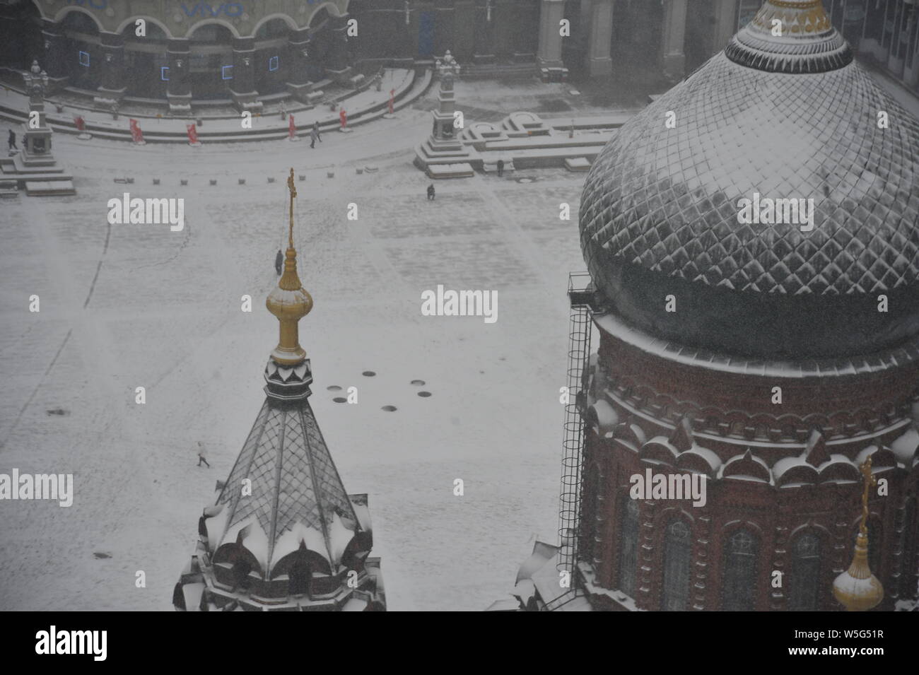 High-rising buildings are covered with snow during a snowfall on the ...