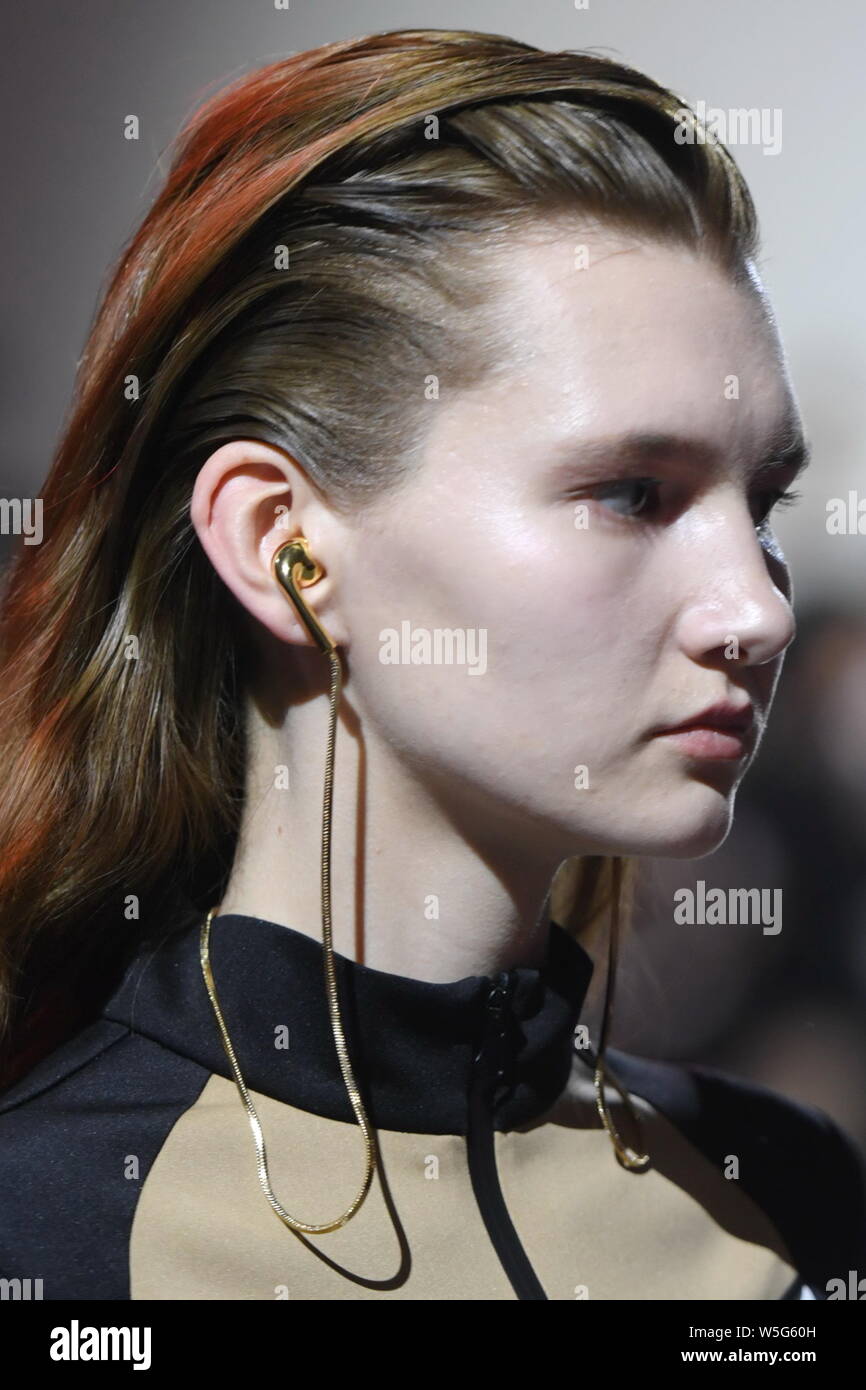 A model displays a new creation at the fashion show of Chris by ...