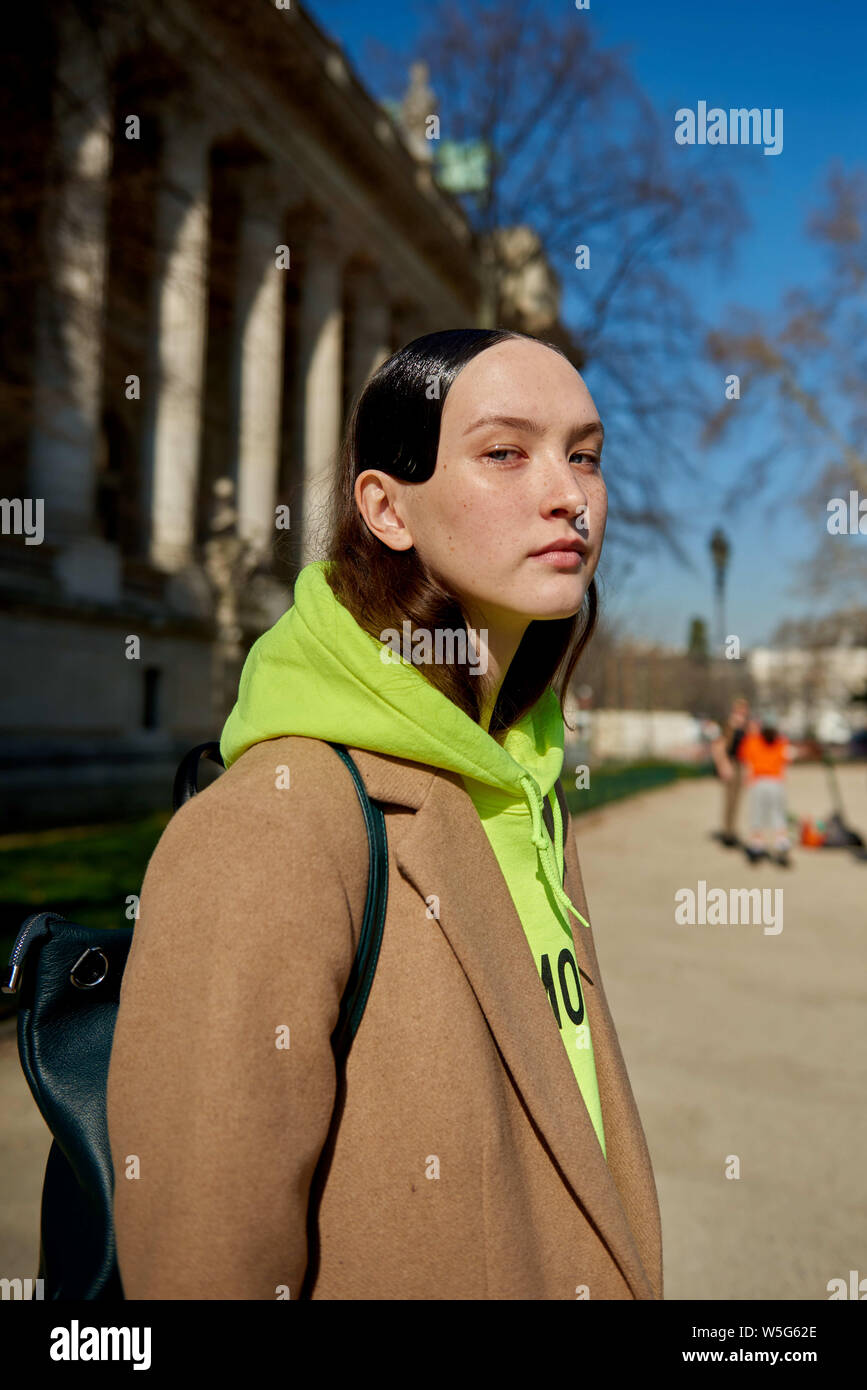 A trendy woman poses for street snaps during the Paris Fashion Week ...