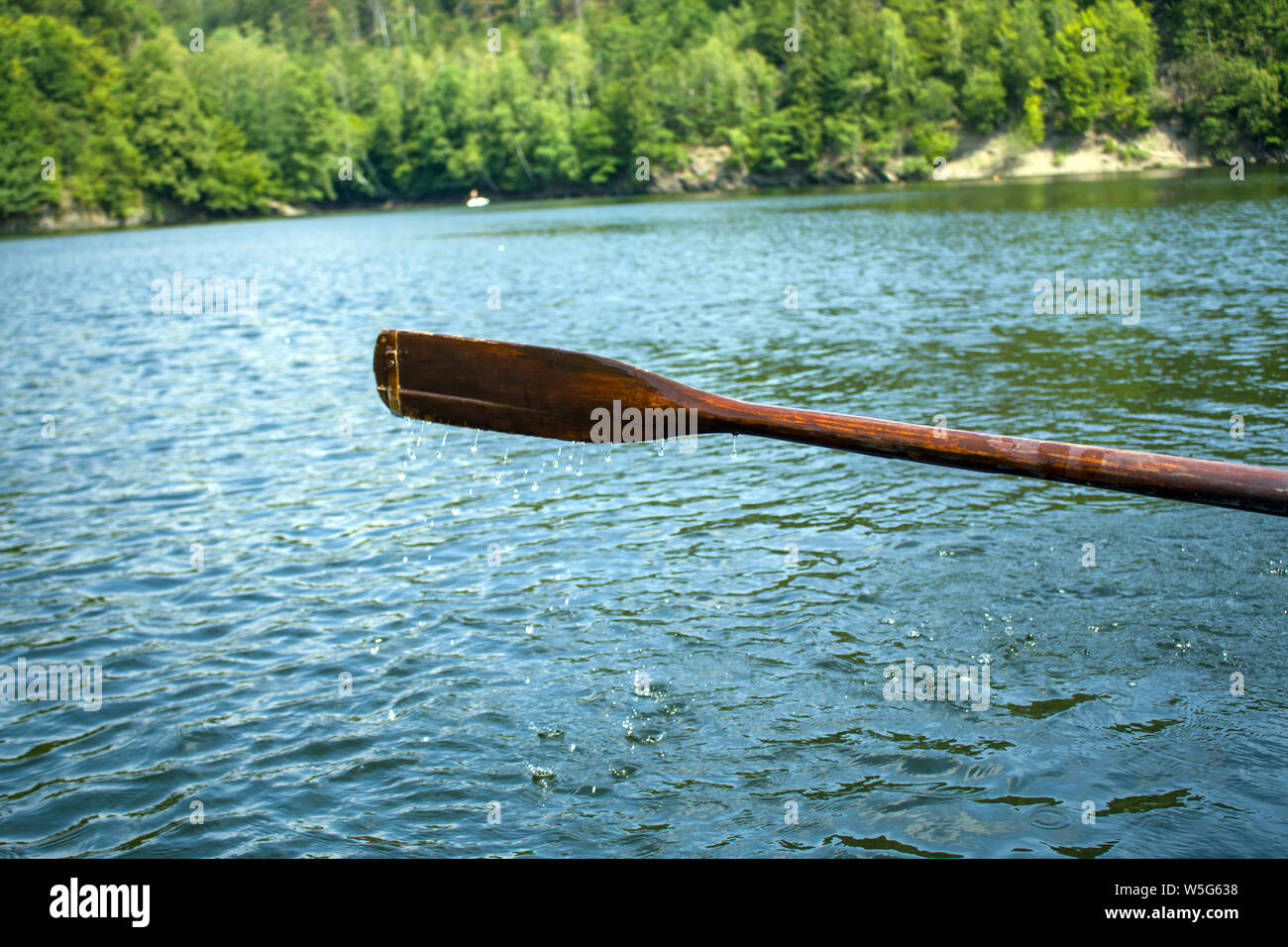 boat oar in the water and splashing water Stock Photo - Alamy