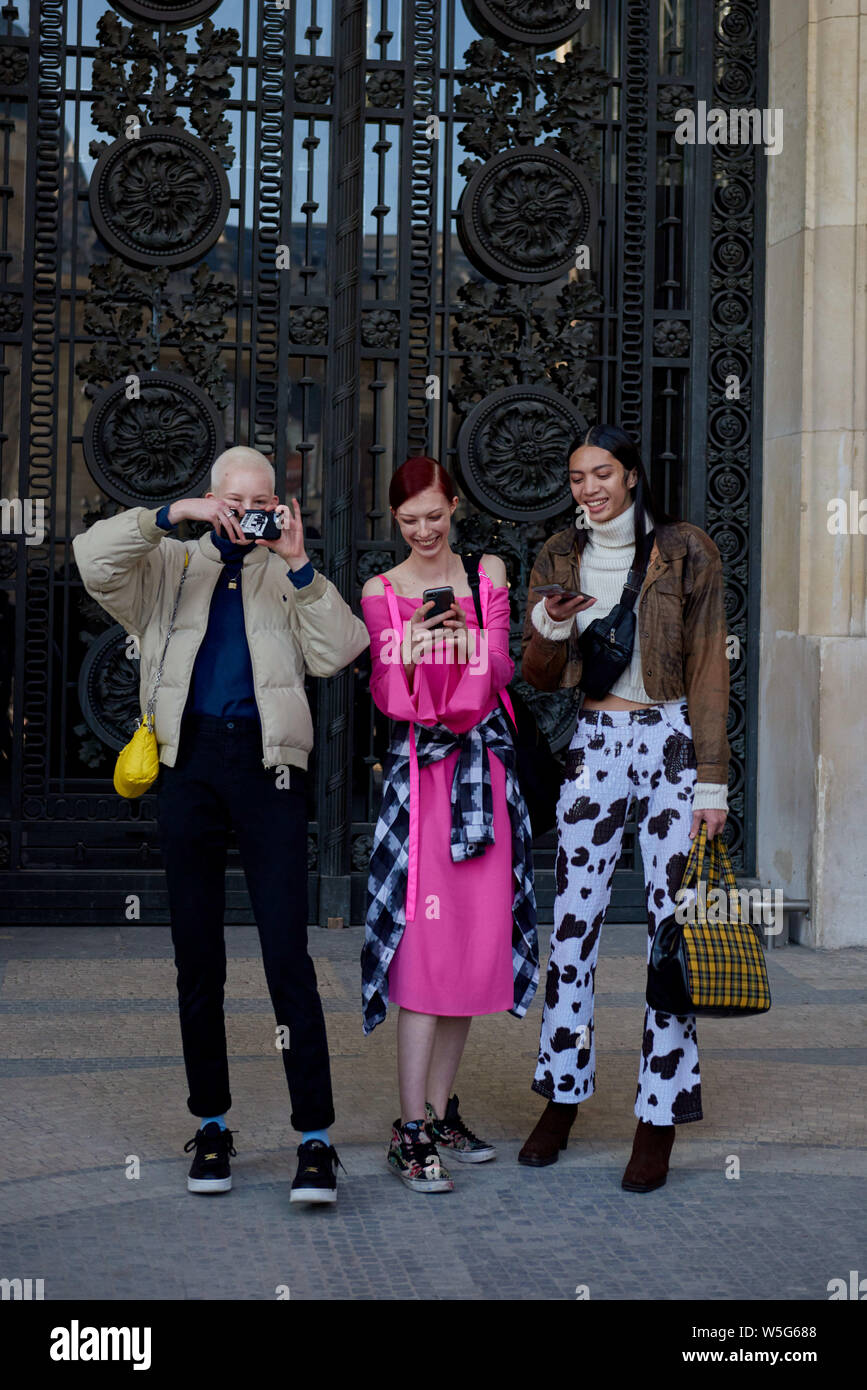 A trendy woman poses for street snaps during the Paris Fashion Week ...
