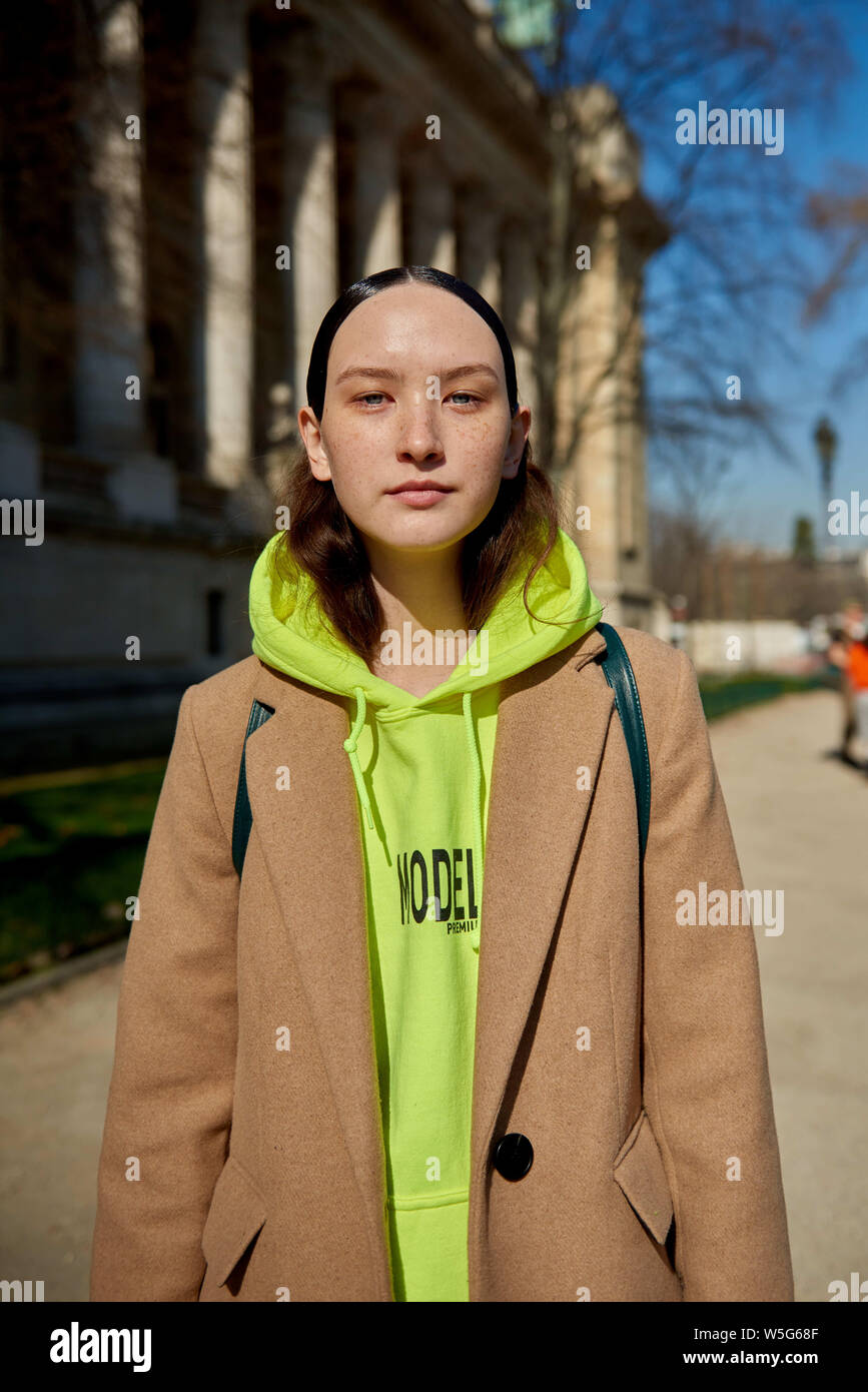 A trendy woman poses for street snaps during the Paris Fashion Week ...