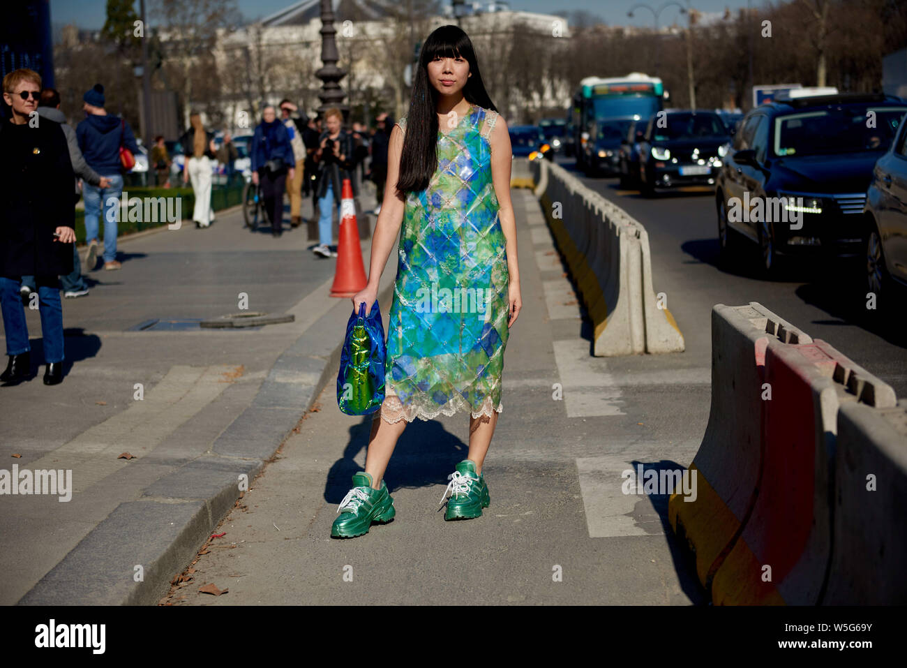 A trendy woman poses for street snaps during the Paris Fashion Week ...