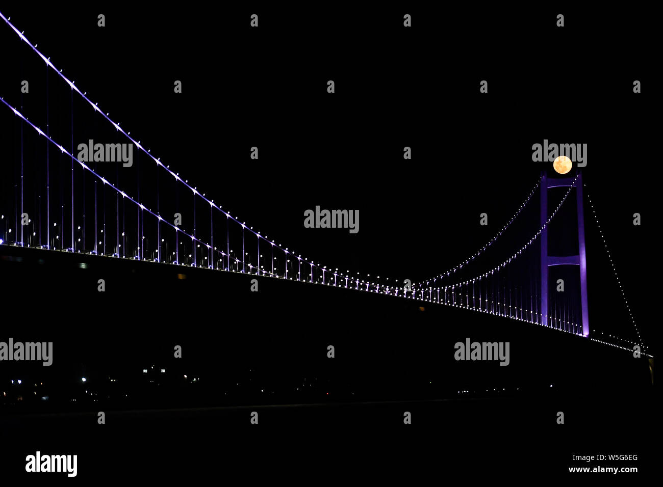 A supermoon is pictured above the second Humen Bridge (Nansha Bridge ...