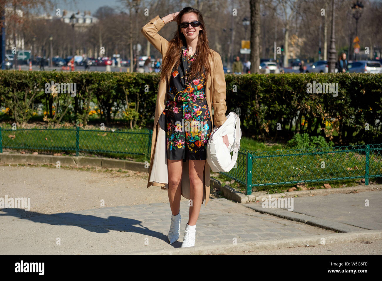 A trendy woman poses for street snaps during the Paris Fashion Week ...