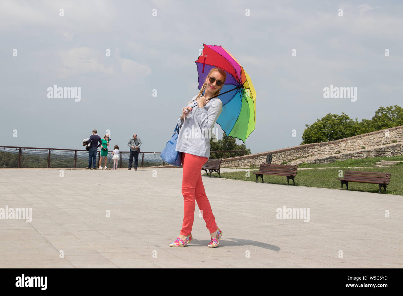 A girl with colorful umbrella, weather forecast Stock Photo - Alamy