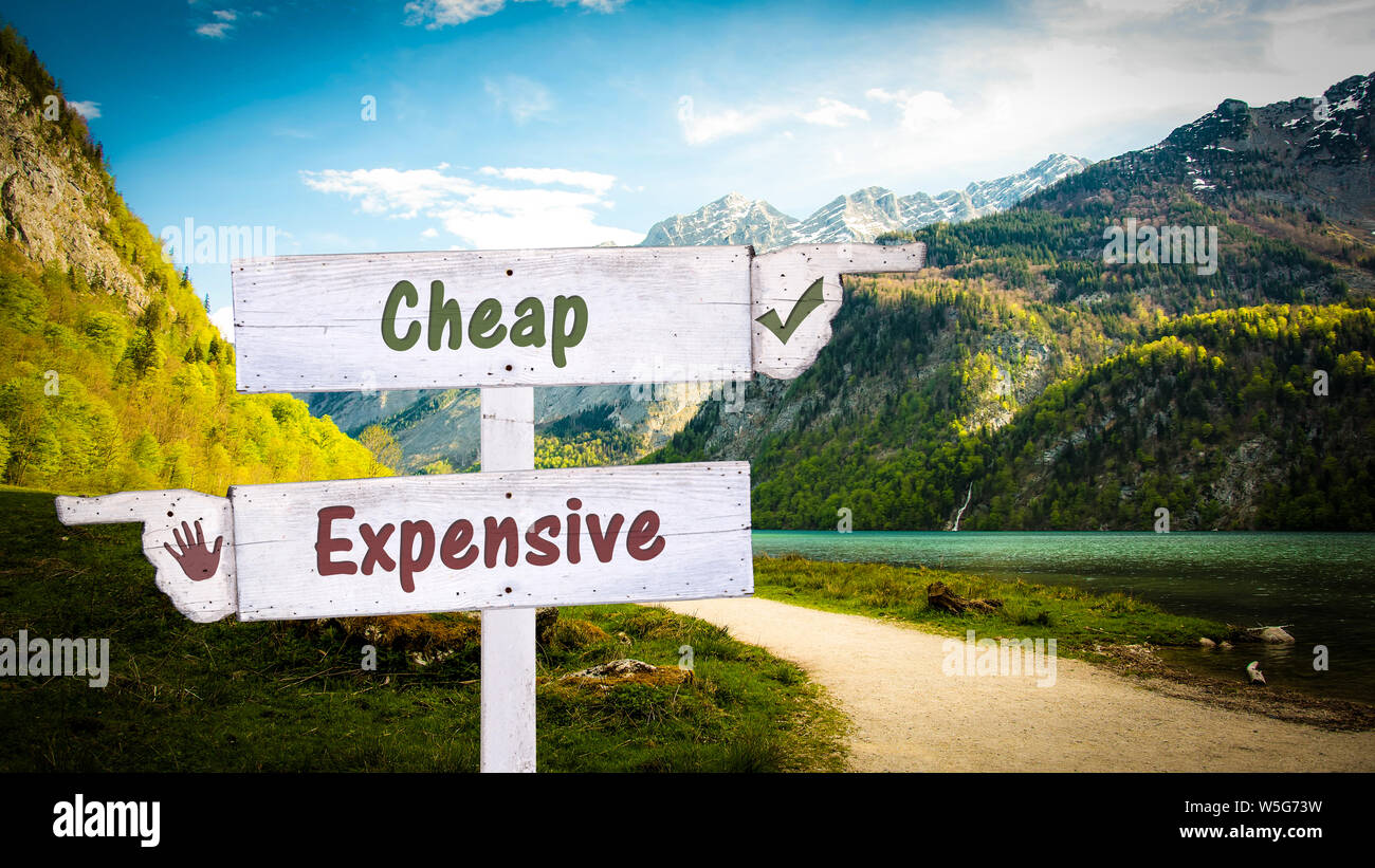 Street Sign the Direction Way to Cheap versus Expensive Stock Photo - Alamy