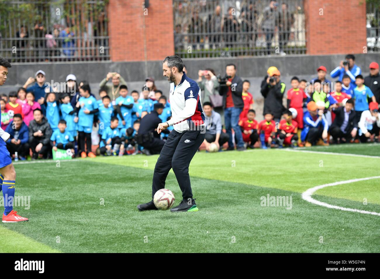 Italian former football player Gianluca Zambrotta plays football with ...