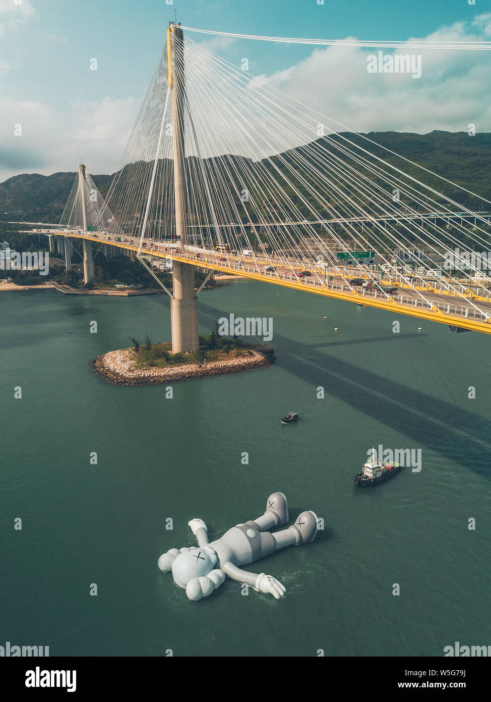 The 37-metre-long floating sculpture by US artist Kaws is placed at the ...