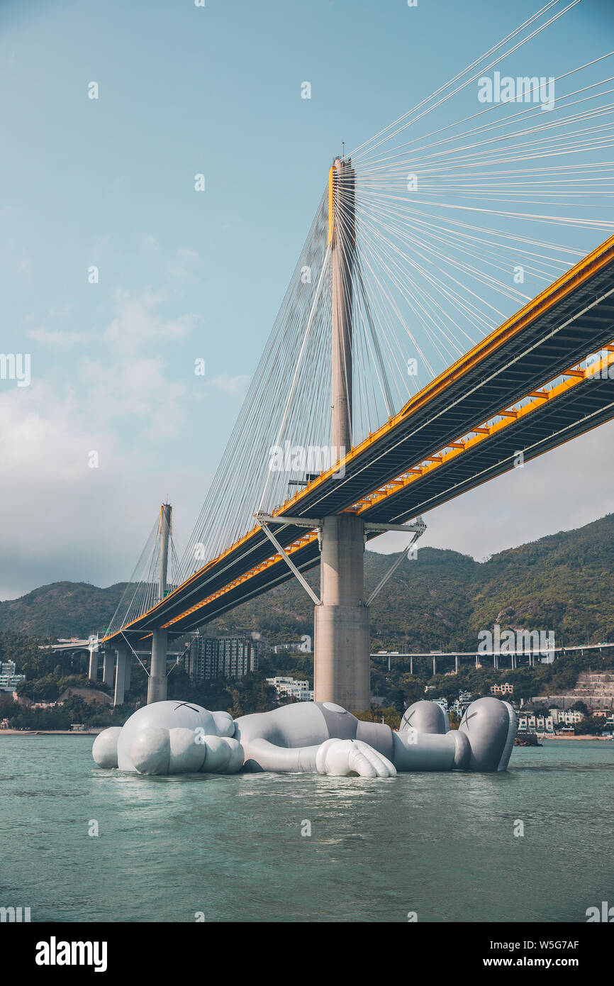 The 37-metre-long floating sculpture by US artist Kaws is placed at the ...