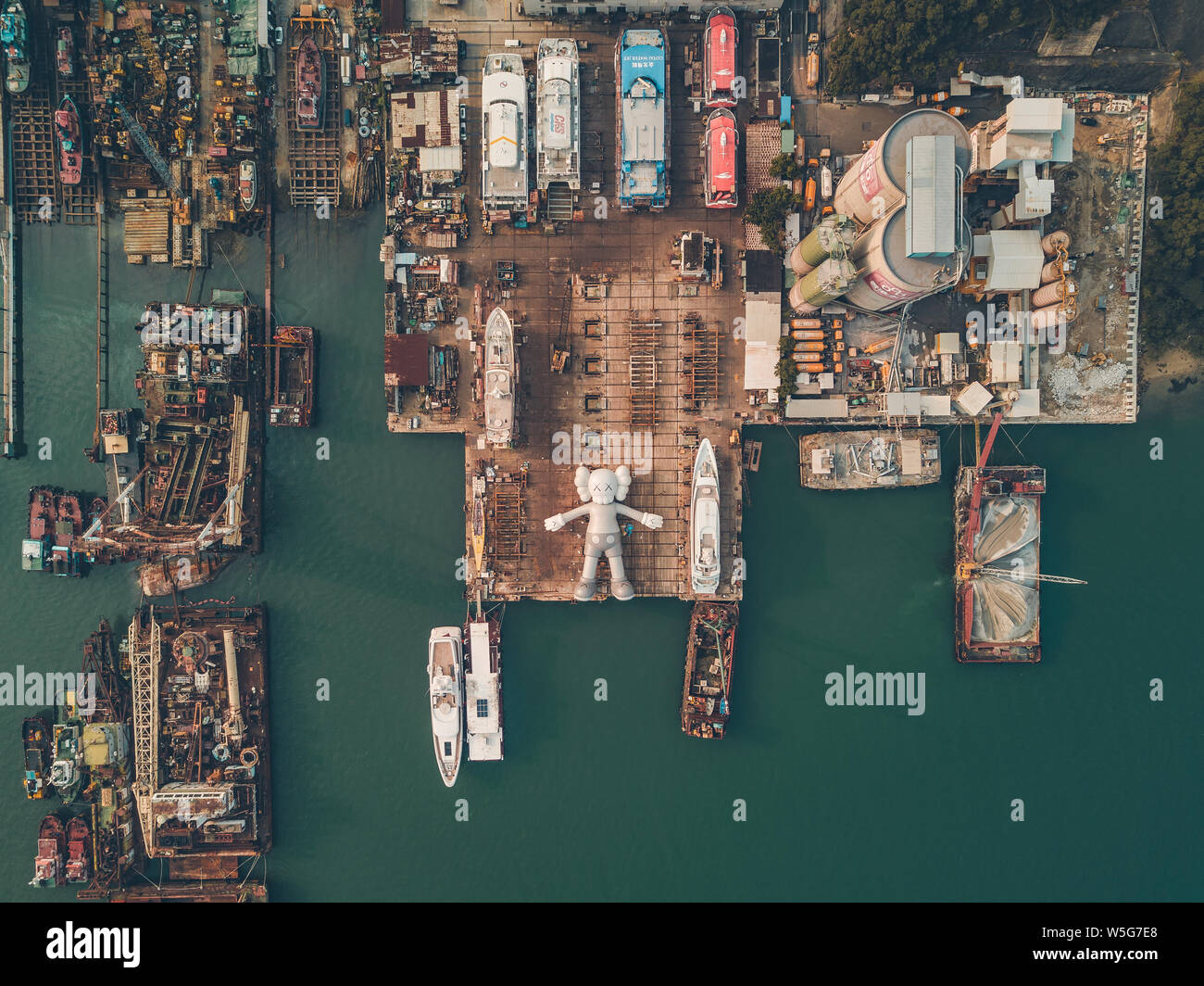 The 37-metre-long floating sculpture by US artist Kaws is placed at the ...