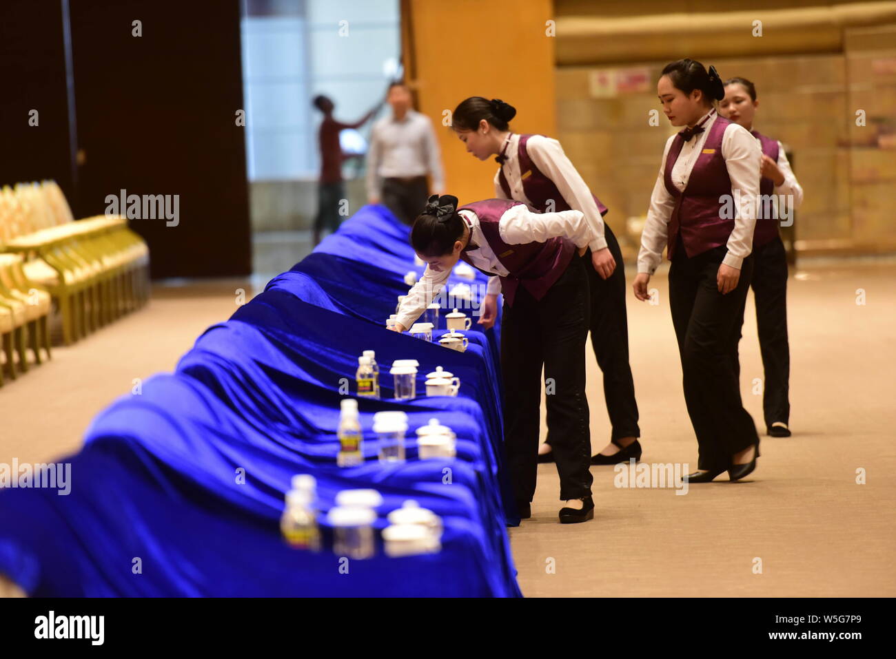 A Chinese worker prepares at the BFA International Convention Center ...