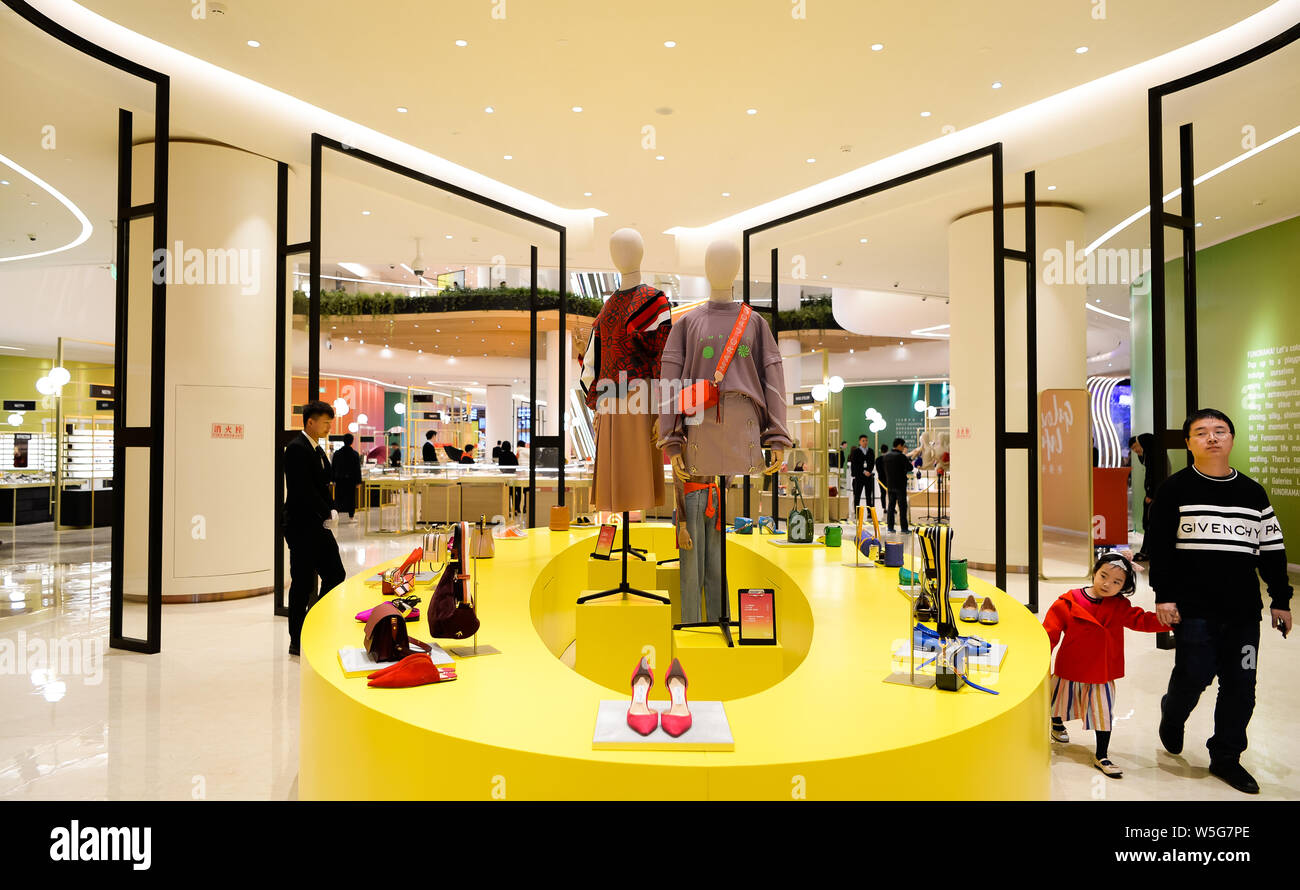 Customers shop at the newest flagship store of French-based high-end ...