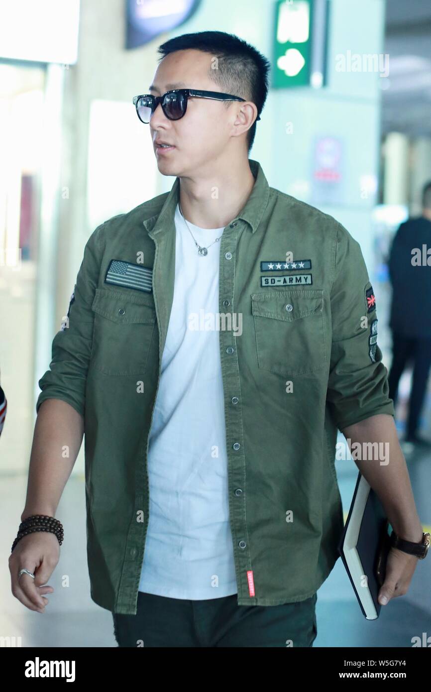 Chinese singer and actor Han Geng arrives at the Beijing Capital ...