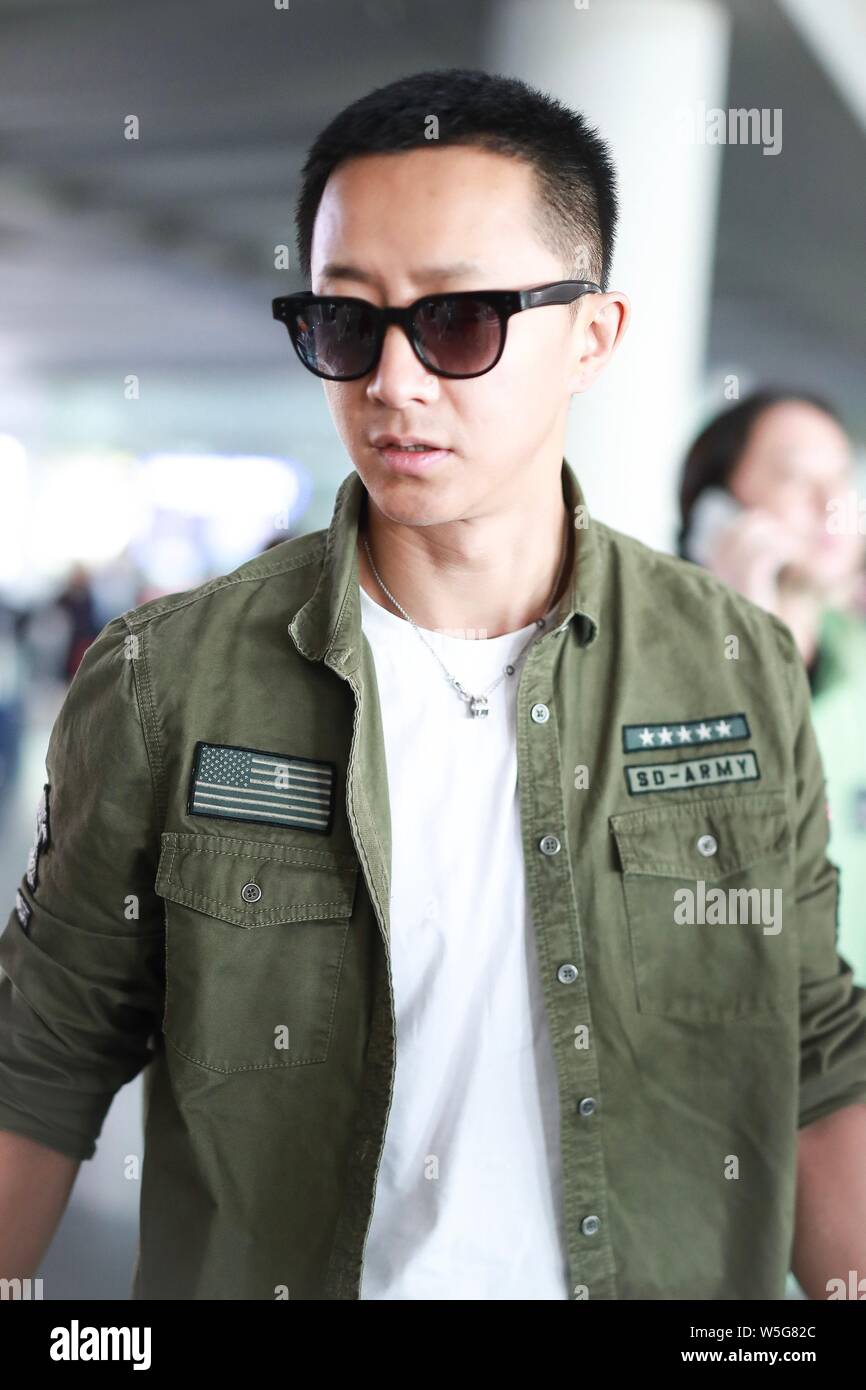 Chinese singer and actor Han Geng arrives at the Beijing Capital ...