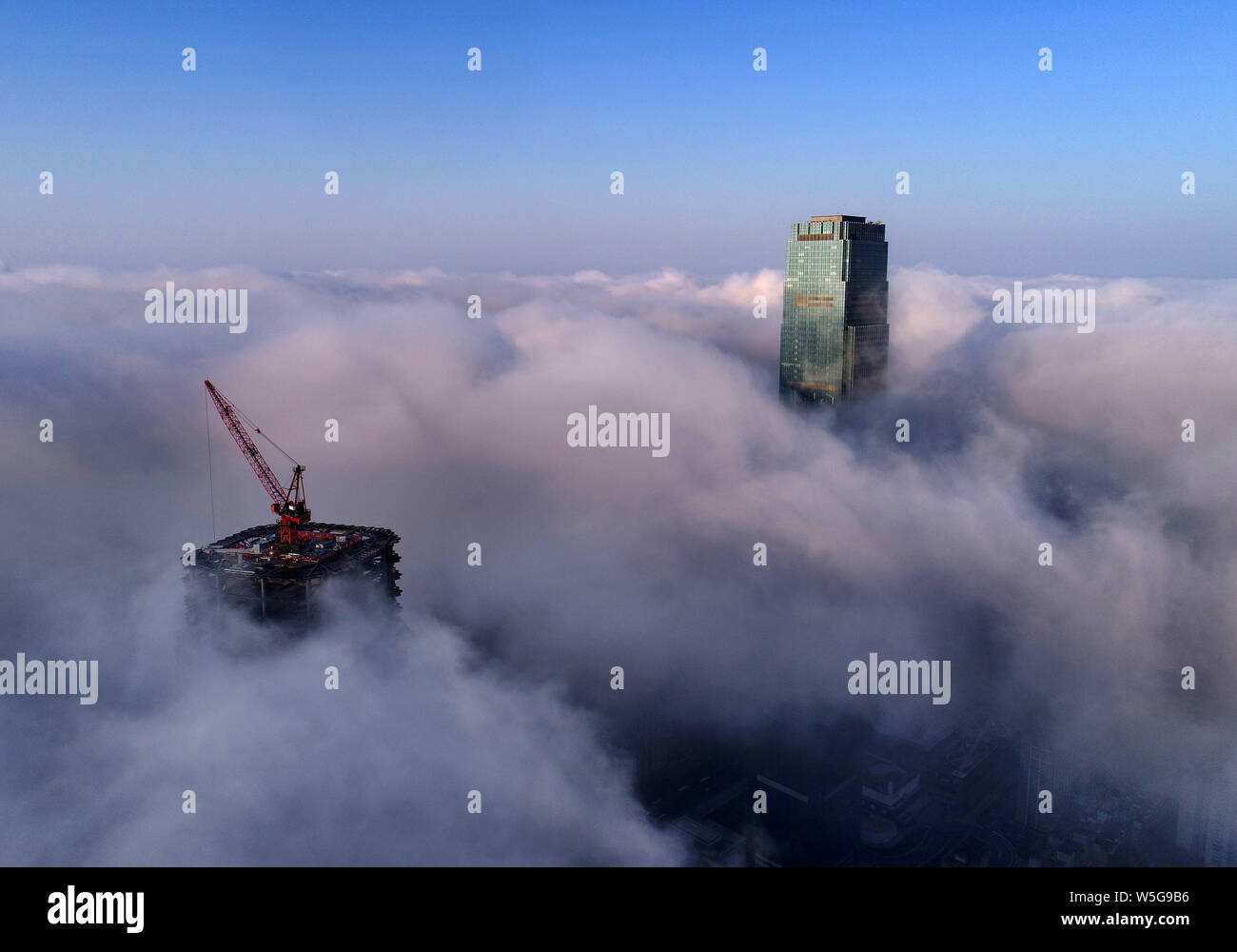 Buildings are shrouded by heavy fog in Changsha city, central China's ...