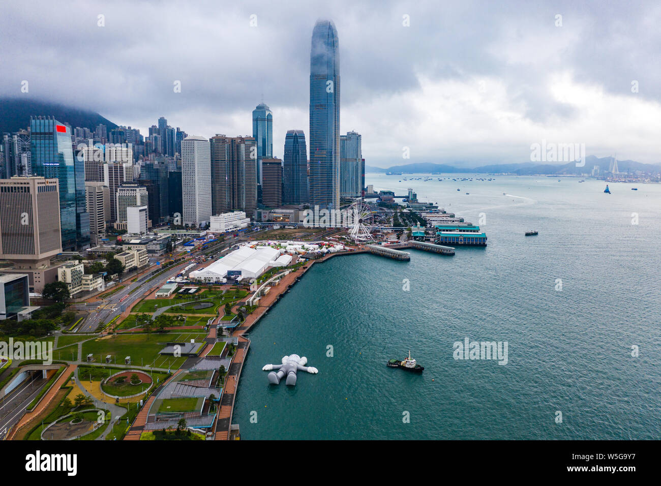 The 37-metre-long floating sculpture by US artist Kaws is docked at the ...