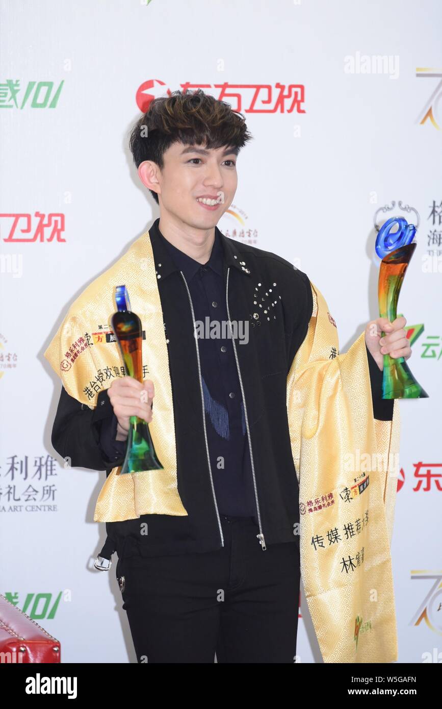 Taiwanese singer Yoga Lin poses with his trophy after winning "Media ...