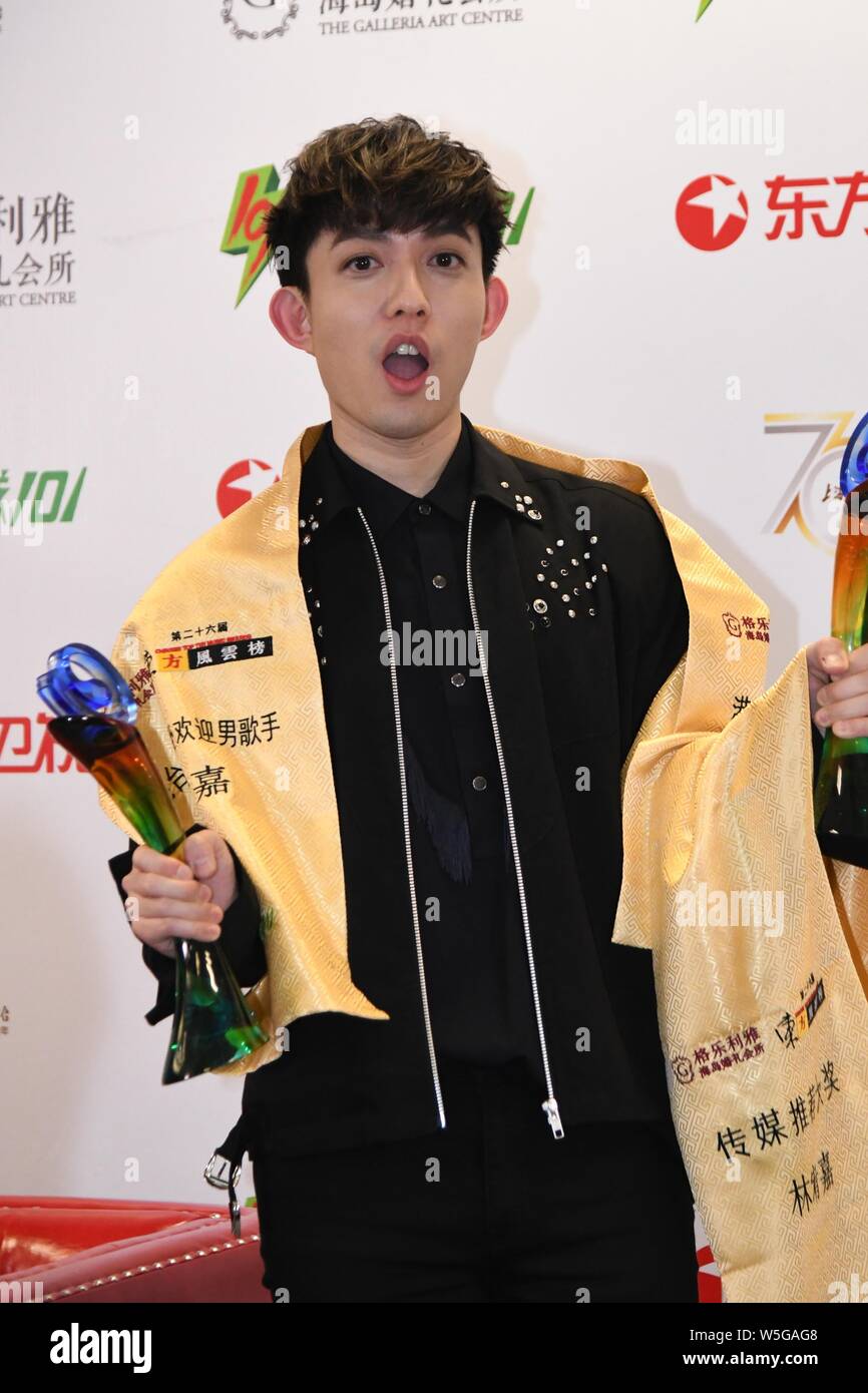 Taiwanese singer Yoga Lin poses with his trophy after winning "Media ...