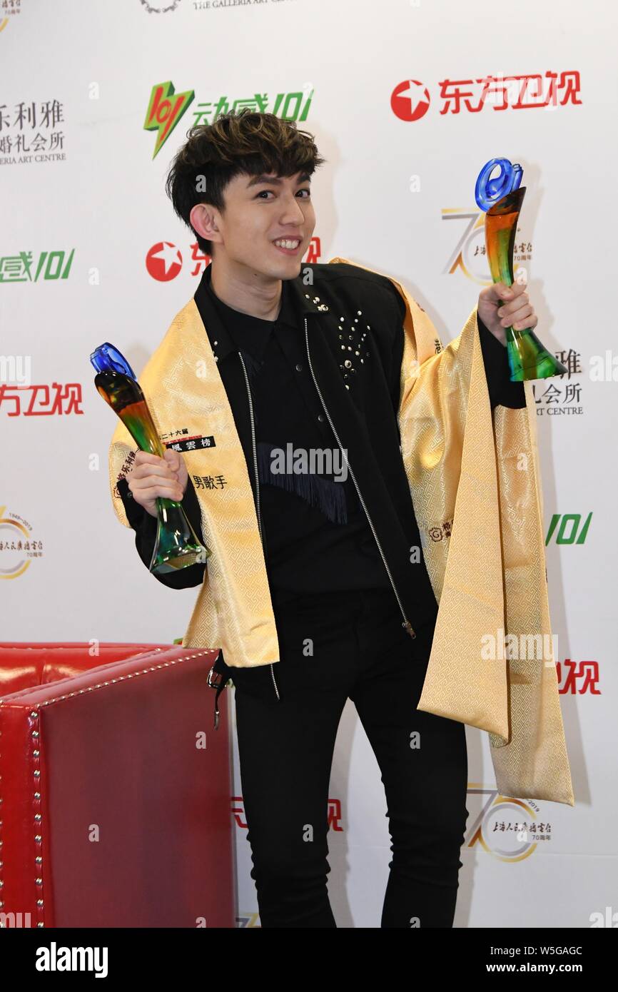 Taiwanese singer Yoga Lin poses with his trophy after winning "Media ...