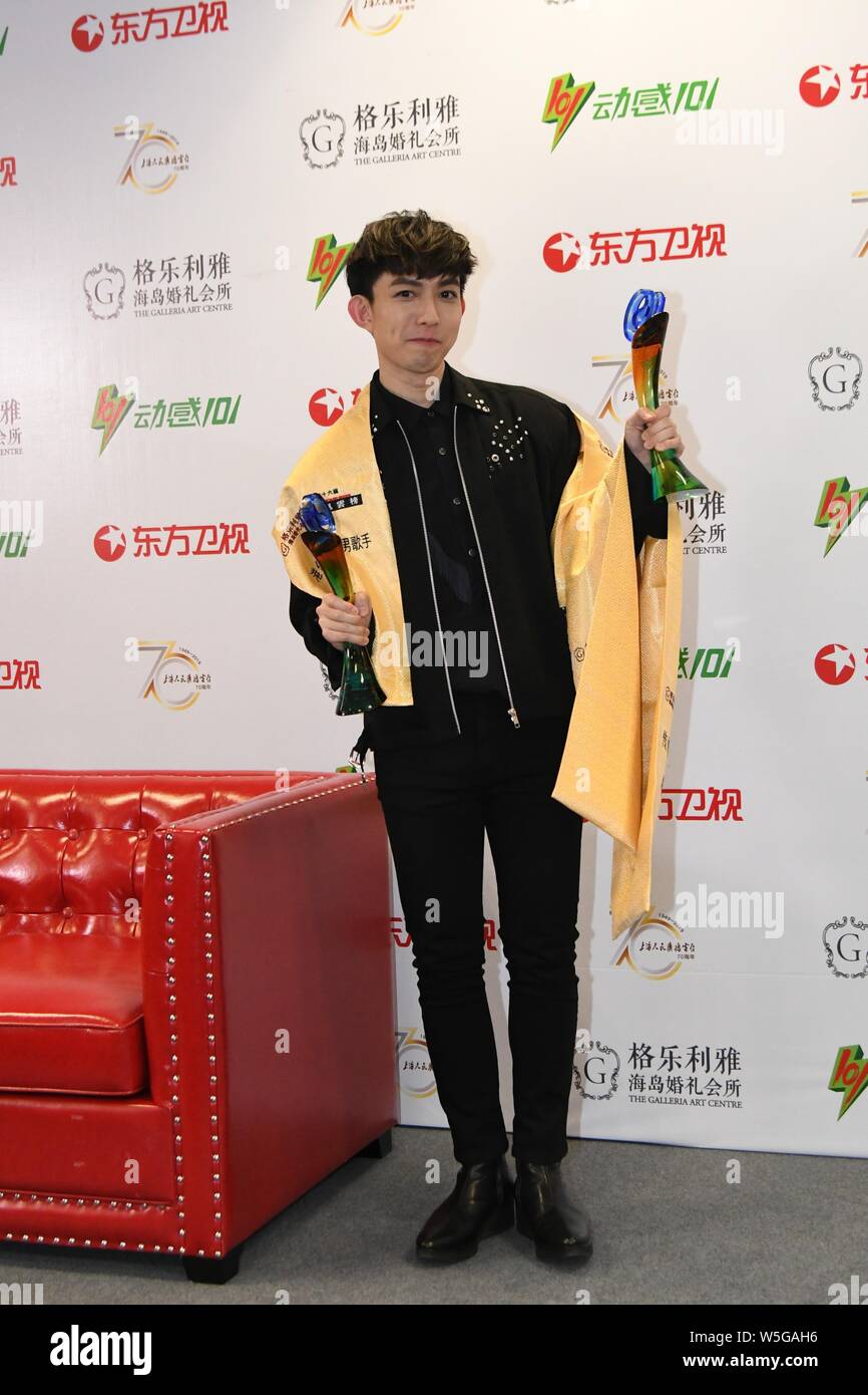 Taiwanese singer Yoga Lin poses with his trophy after winning "Media ...