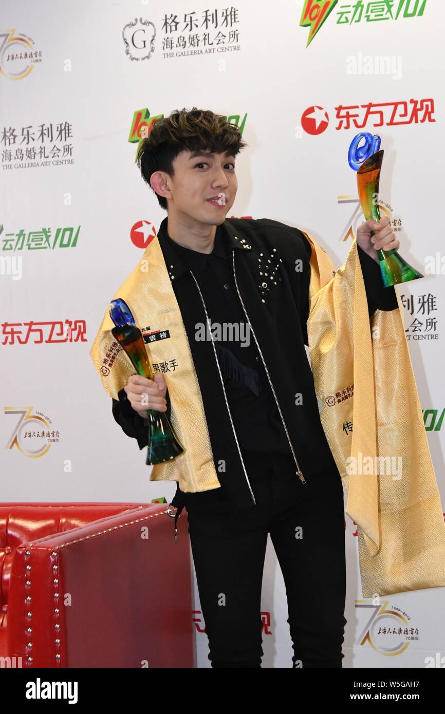 Taiwanese singer Yoga Lin poses with his trophy after winning "Media ...