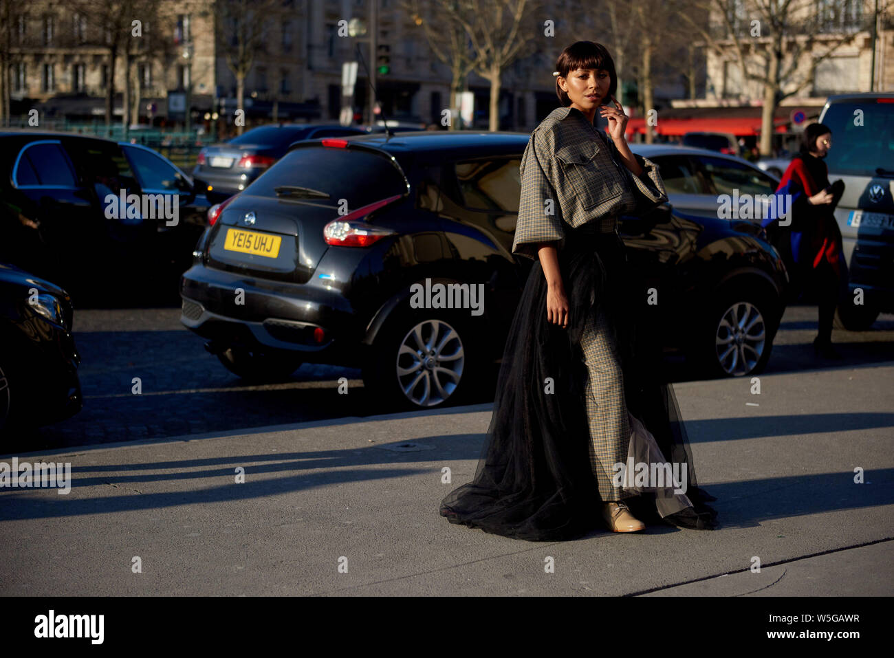 A trendy woman poses for street snaps during the Paris Fashion Week ...