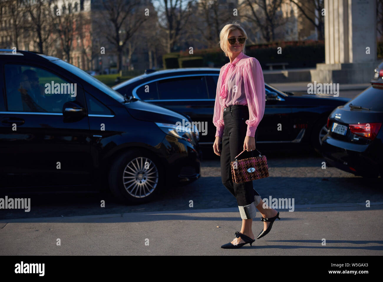 A trendy woman poses for street snaps during the Paris Fashion Week ...