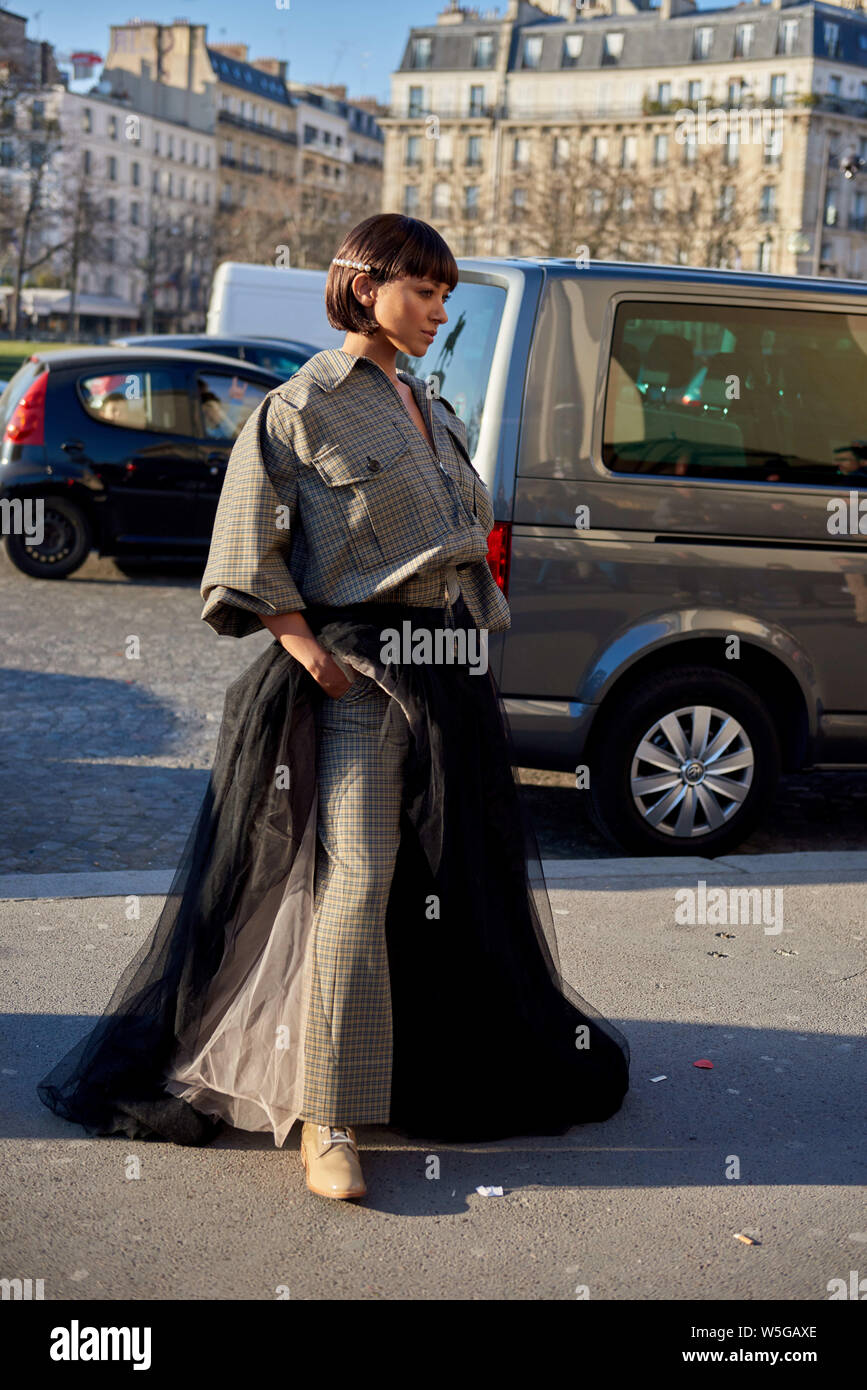 A trendy woman poses for street snaps during the Paris Fashion Week ...