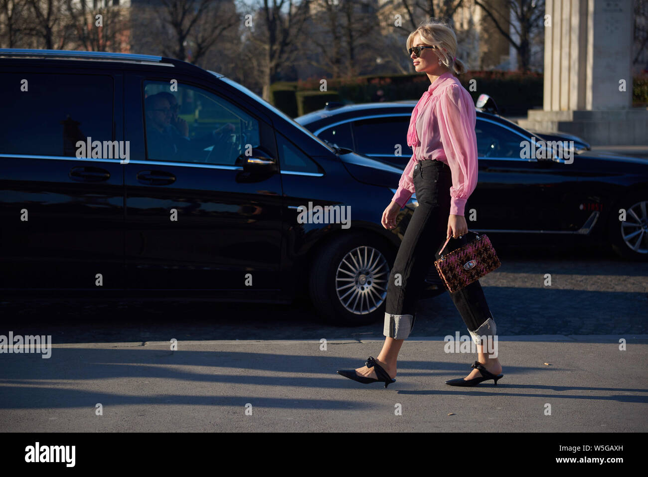 A trendy woman poses for street snaps during the Paris Fashion Week ...