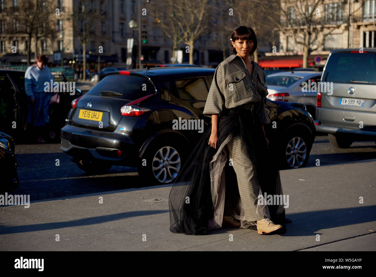 A trendy woman poses for street snaps during the Paris Fashion Week ...