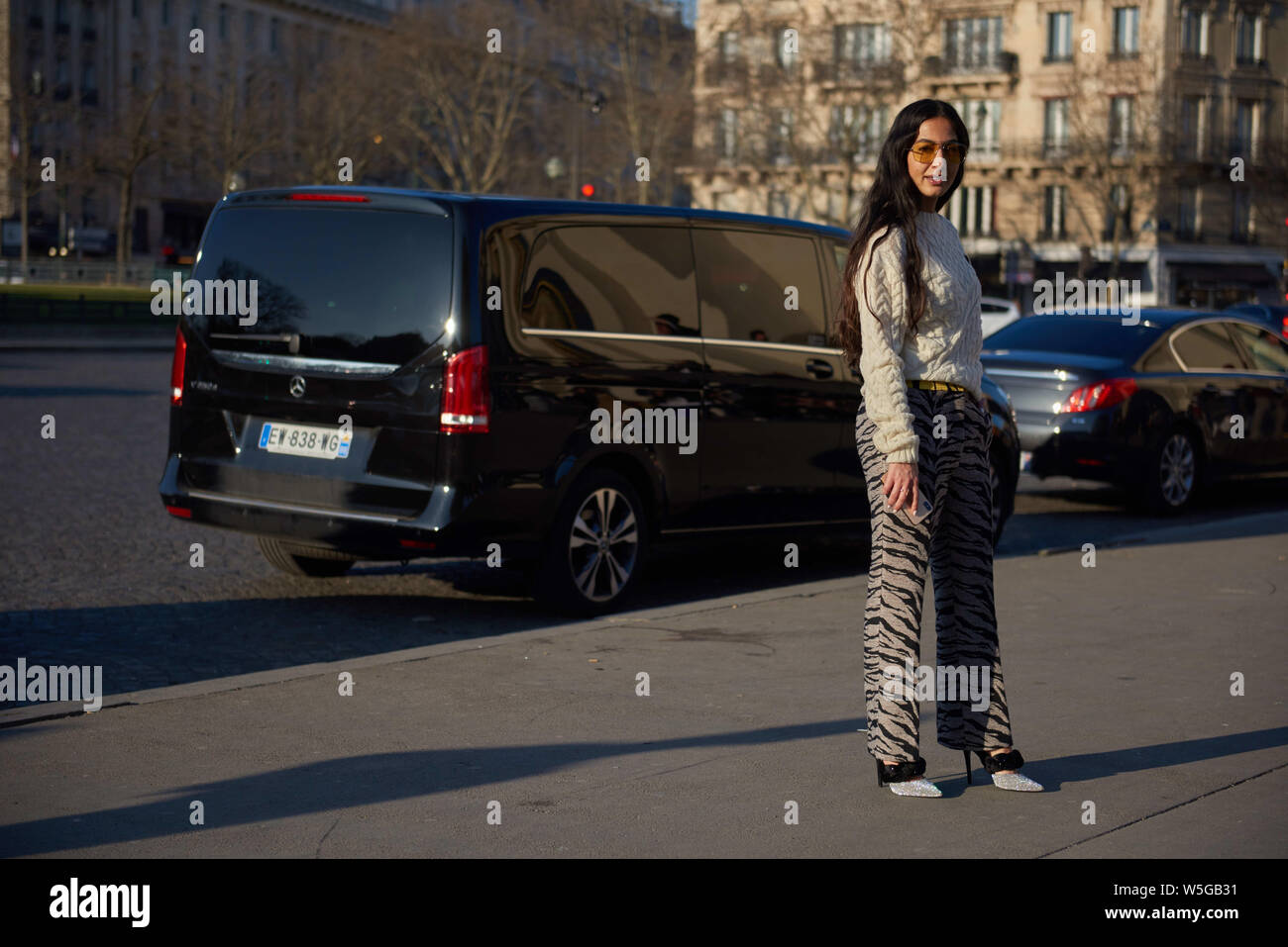 A trendy woman poses for street snaps during the Paris Fashion Week ...