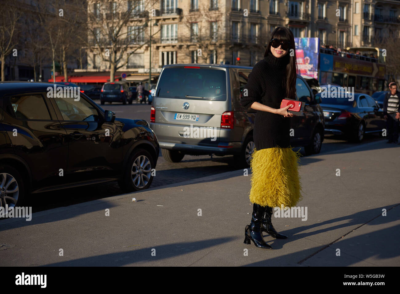 A trendy woman poses for street snaps during the Paris Fashion Week ...
