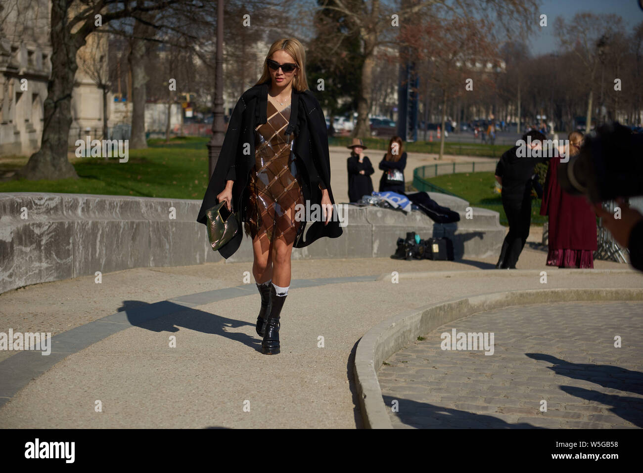 A trendy woman poses for street snaps during the Paris Fashion Week ...