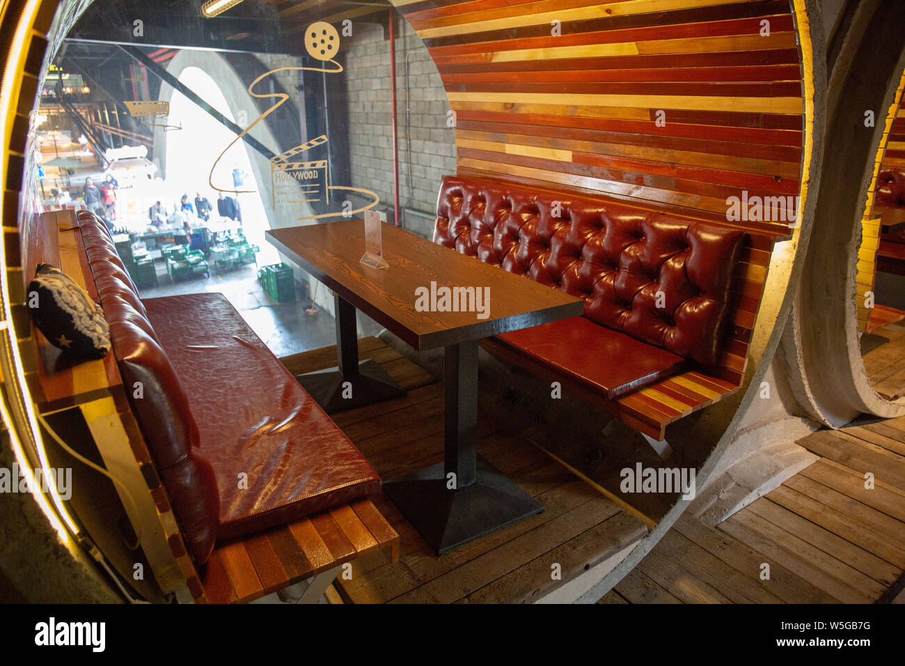 Interior view of a private dining rooms made of cement pipes inlayed ...
