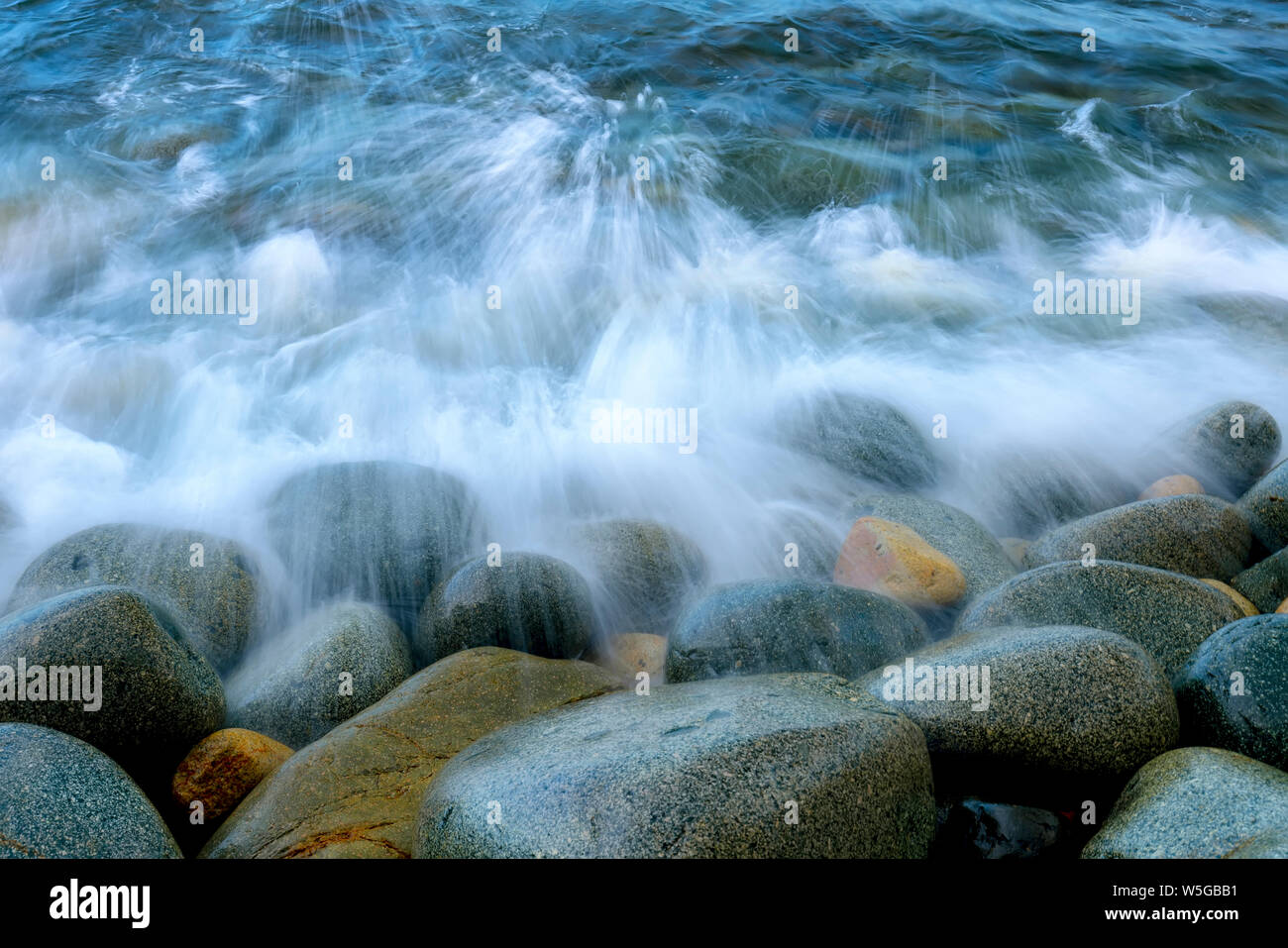 Smooth waves on giant rocks like eggs interesting Stock Photo - Alamy