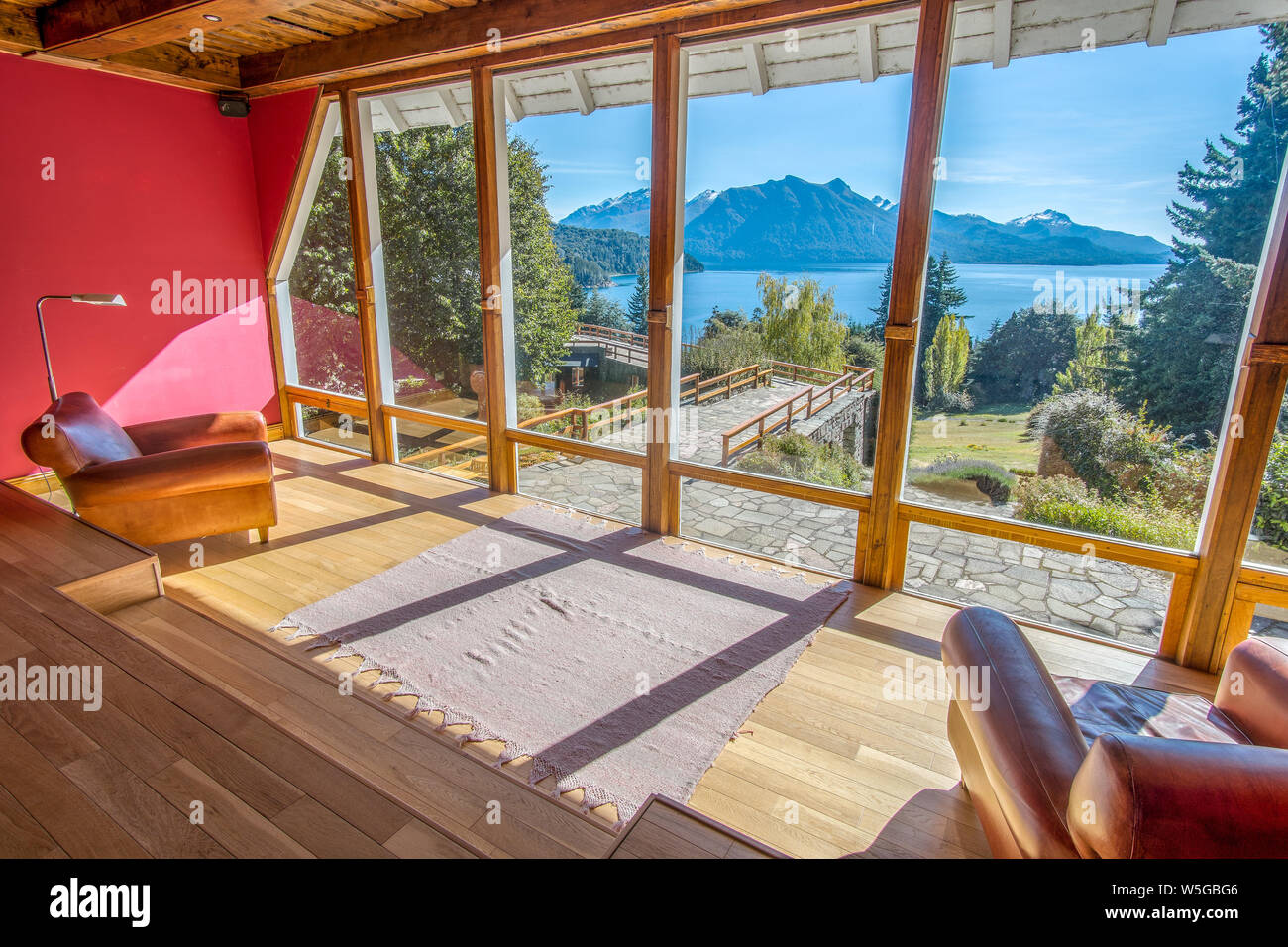 A room with large windows overlooking Lake in Bariloche Stock Photo - Alamy