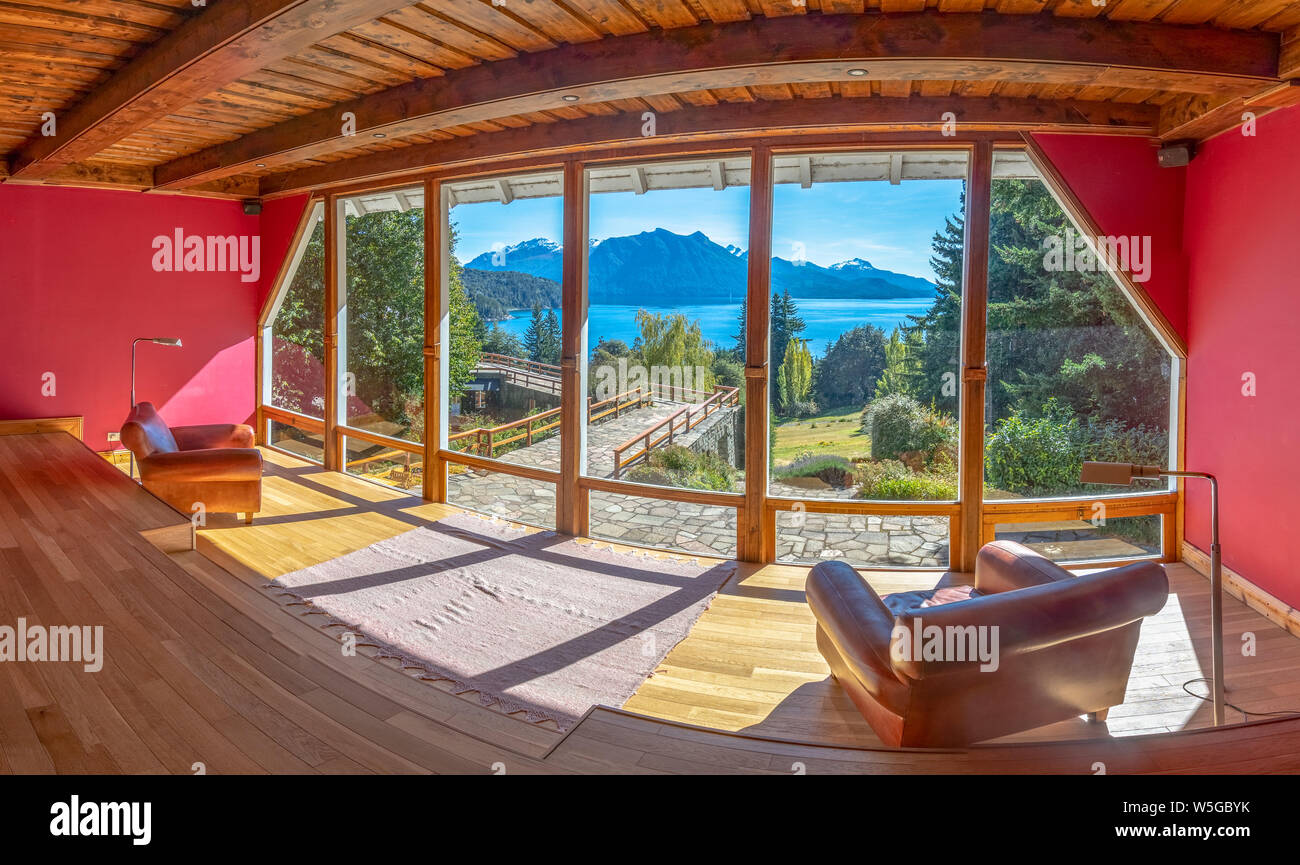A room with large windows overlooking Lake in Bariloche Stock Photo - Alamy