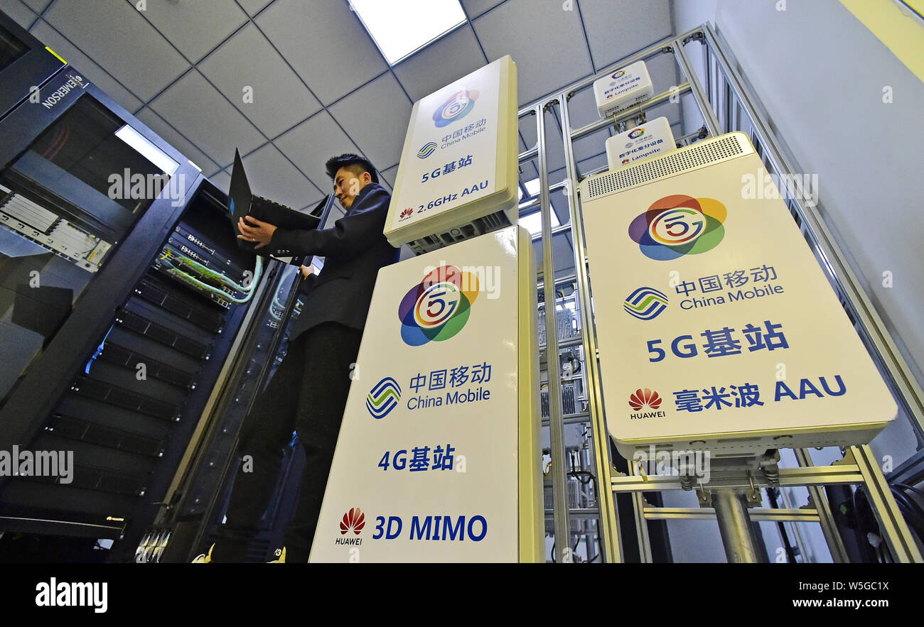 A Chinese worker tests equipments at Tianjin's first 5G base station in ...