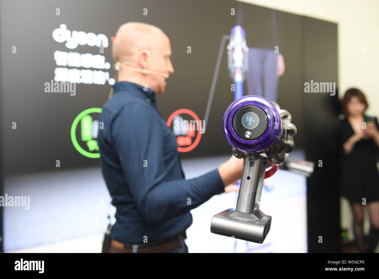 Kevin Grant, Head of Floorcare at Dyson in Southeast Asia, demonstrates ...