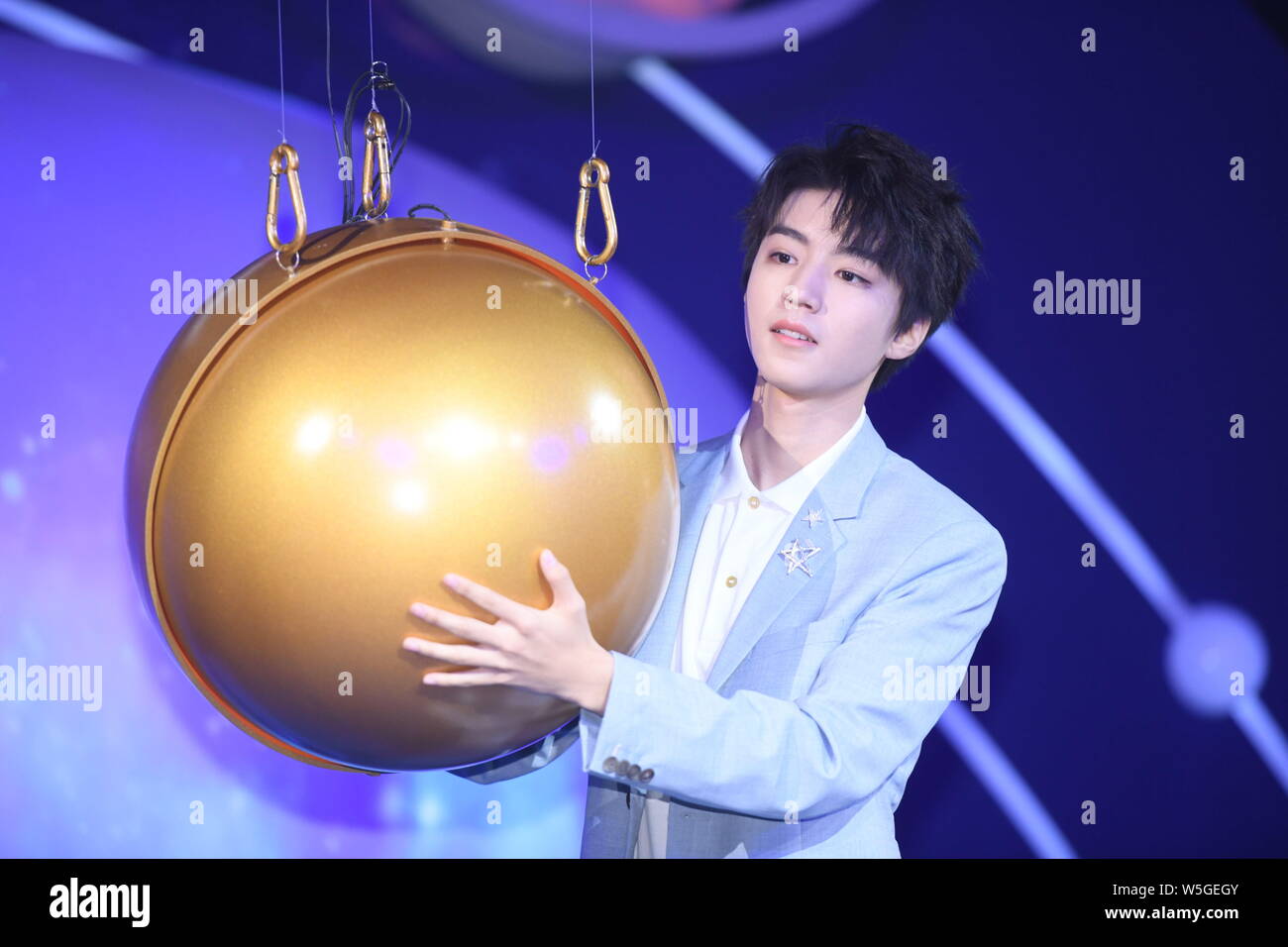 Karry Wang Jun Kai of Chinese boy group TFBoys attends a promotional ...