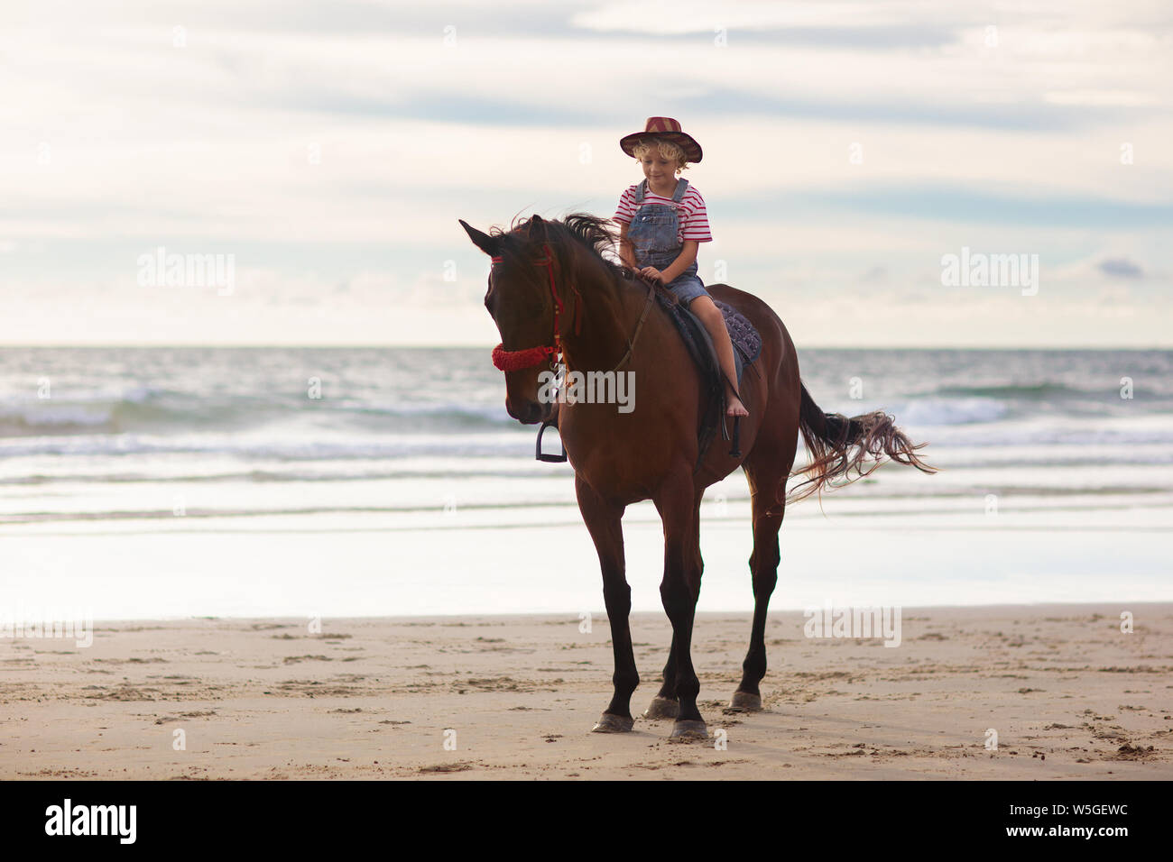 Child horse riding helmet sand hi-res stock photography and images - Alamy