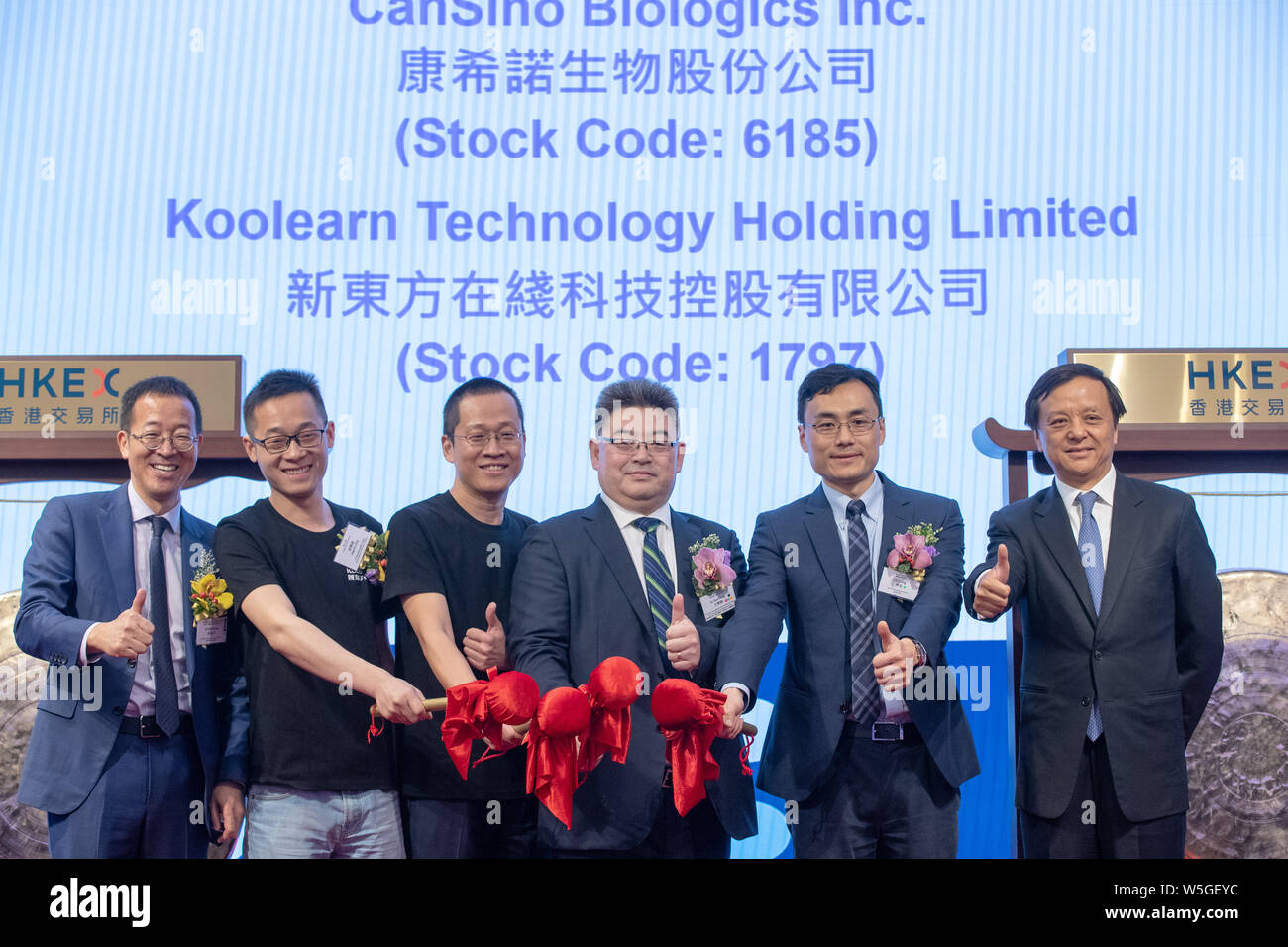 Yu Xuefeng, third right, co-founder, Chairman and CEO of CanSino ...