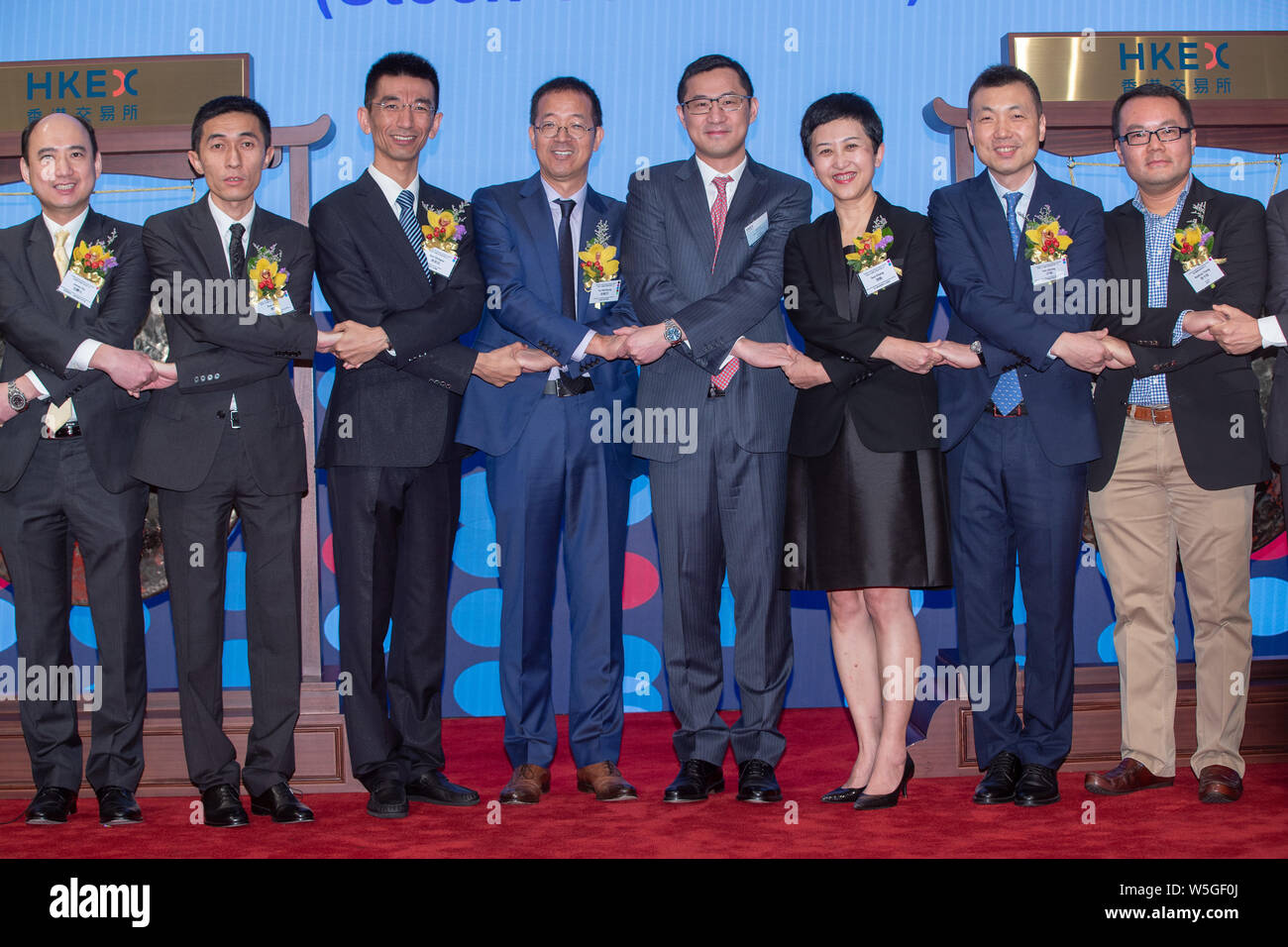Michael Yu Minhong, center left, founder and CEO of New Oriental ...