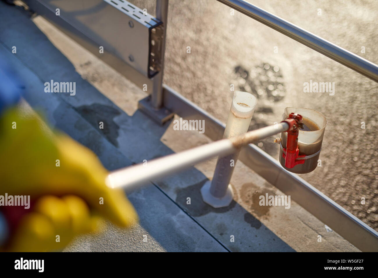 Scientific research - taking samples from the septic tank Stock Photo ...